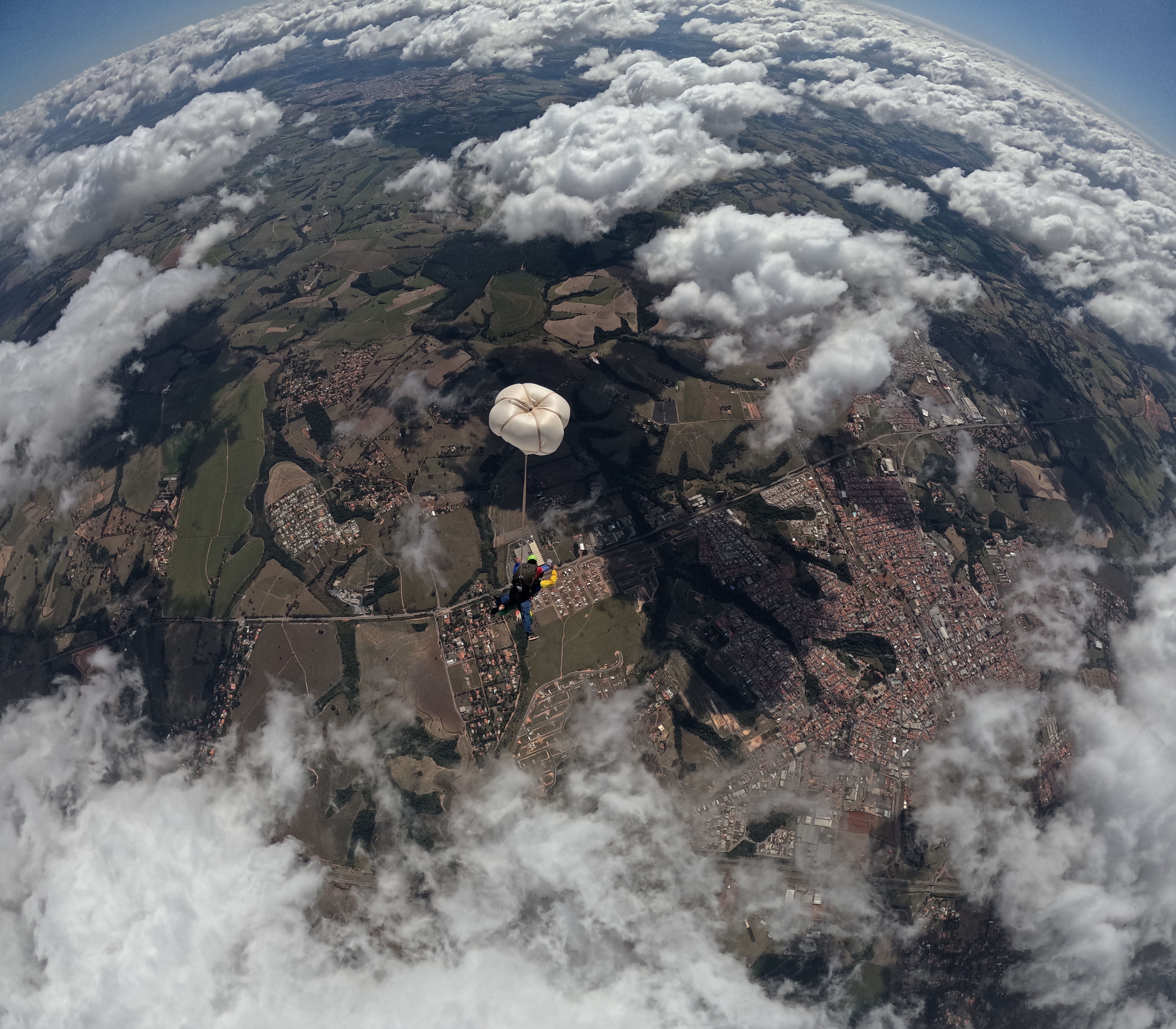 Dramatic Aerial View of Skydiver Descent · Free Stock Photo