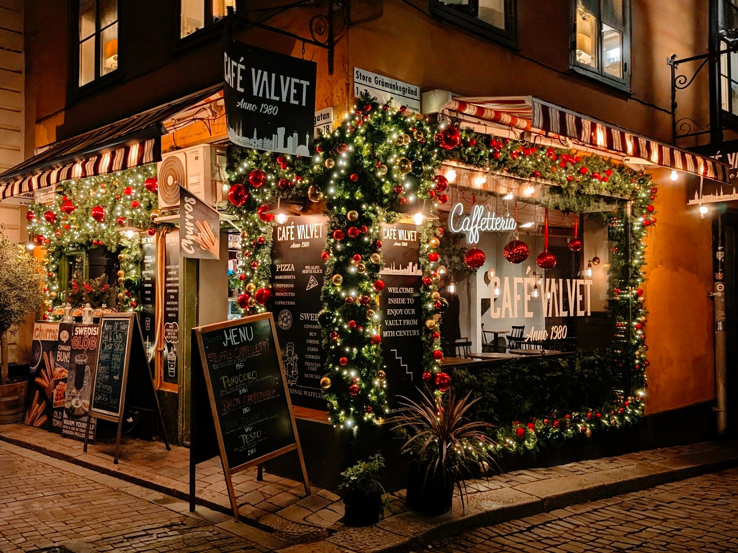 Charming Christmas Cafe in Stockholm's evening glow · Free Stock Photo