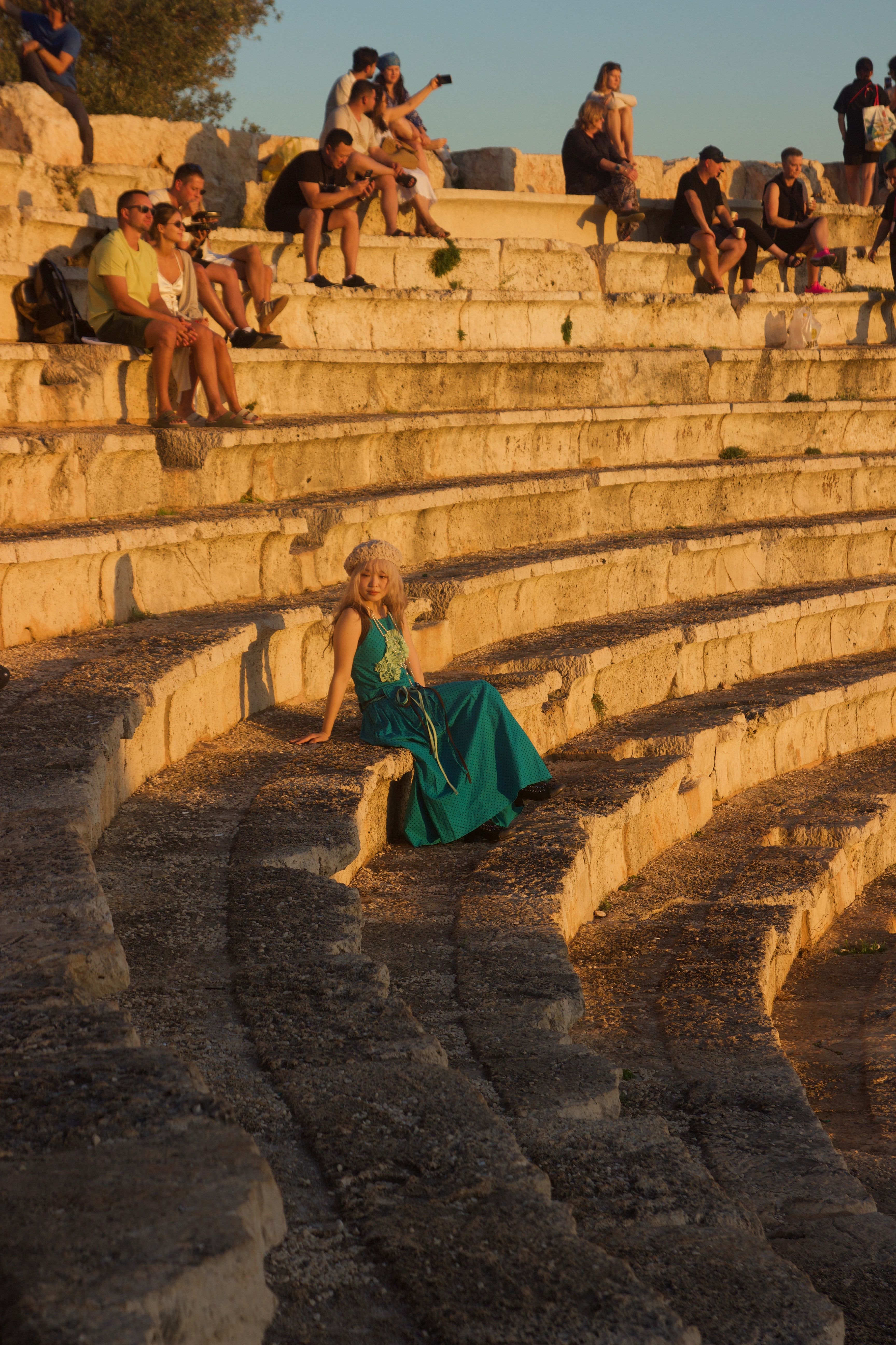 Tourists Gather in Ancient Stone Amphitheater · Free Stock Photo