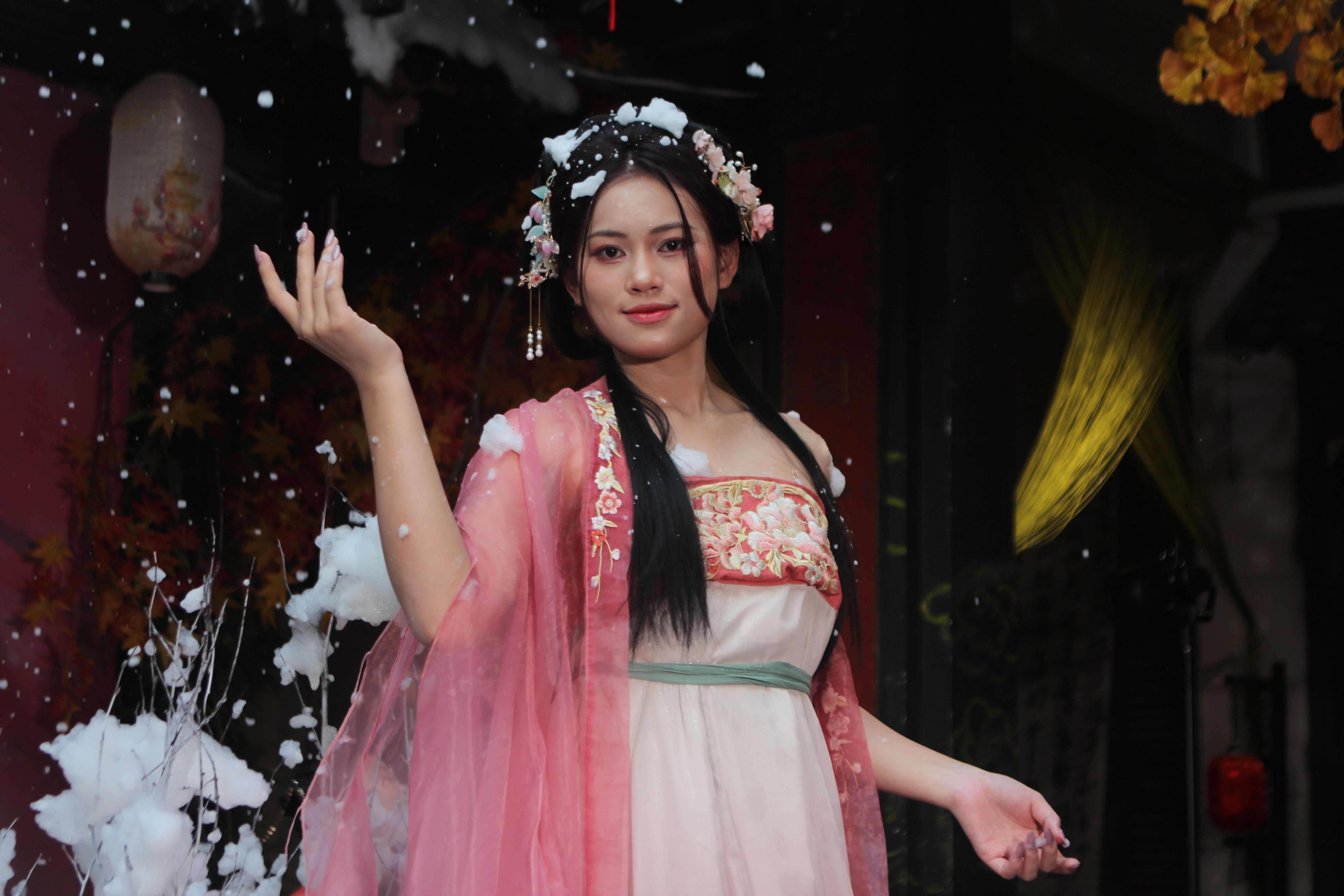 Traditional Asian Attire in Indoor Snowfall · Free Stock Photo