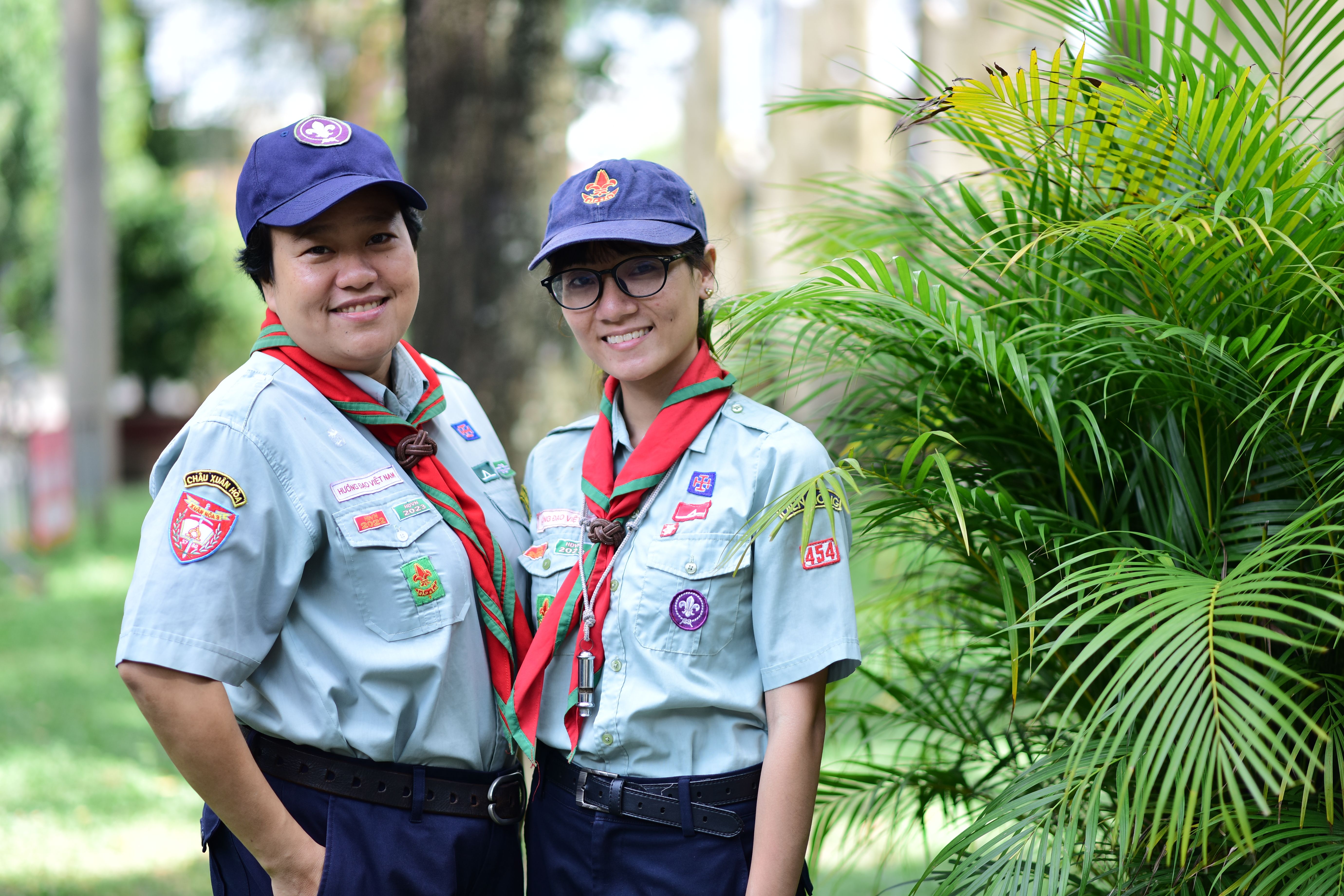 Two Scouts Posing Outdoors in Uniform · Free Stock Photo