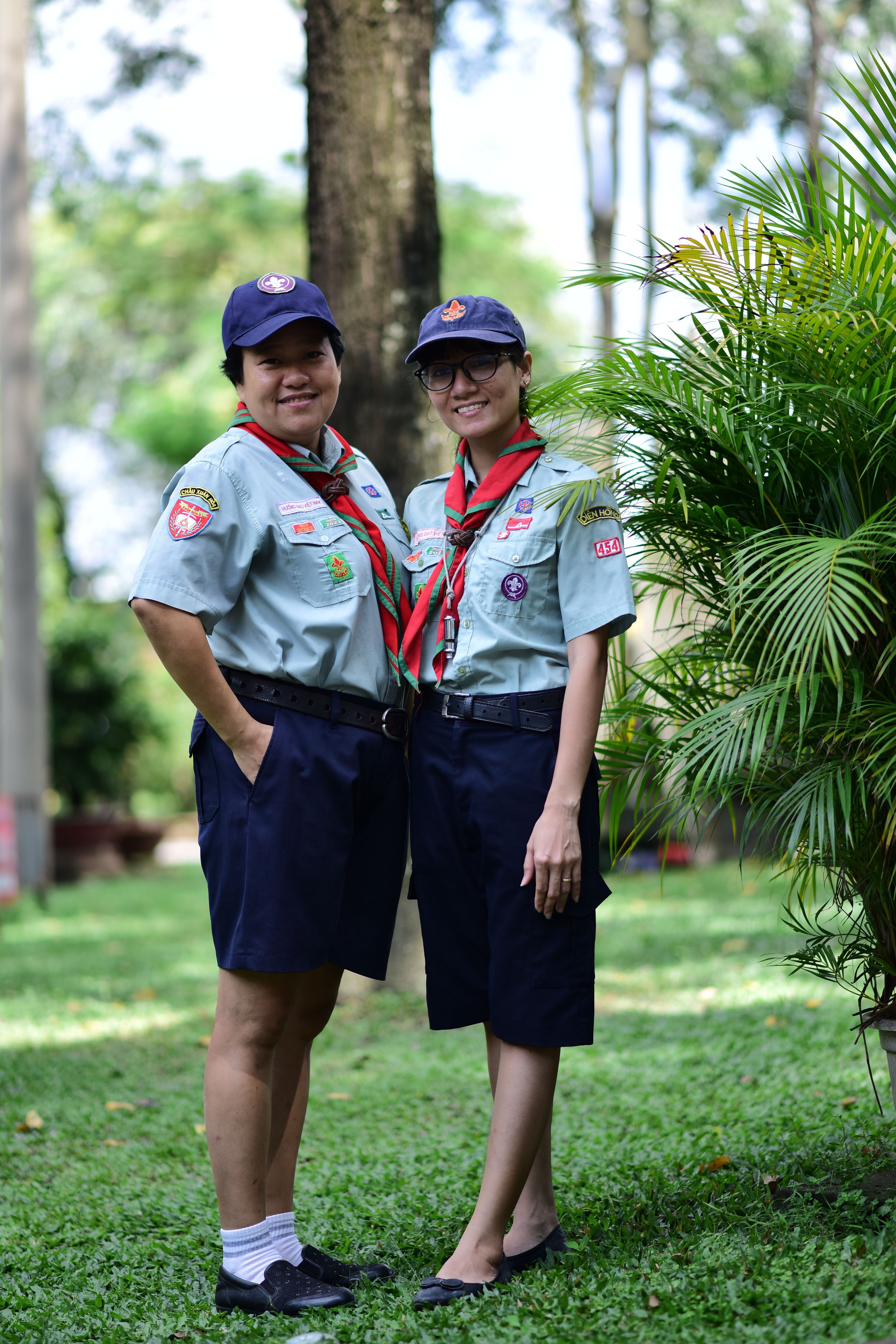 Two Female Scout Leaders Posing Outdoors · Free Stock Photo