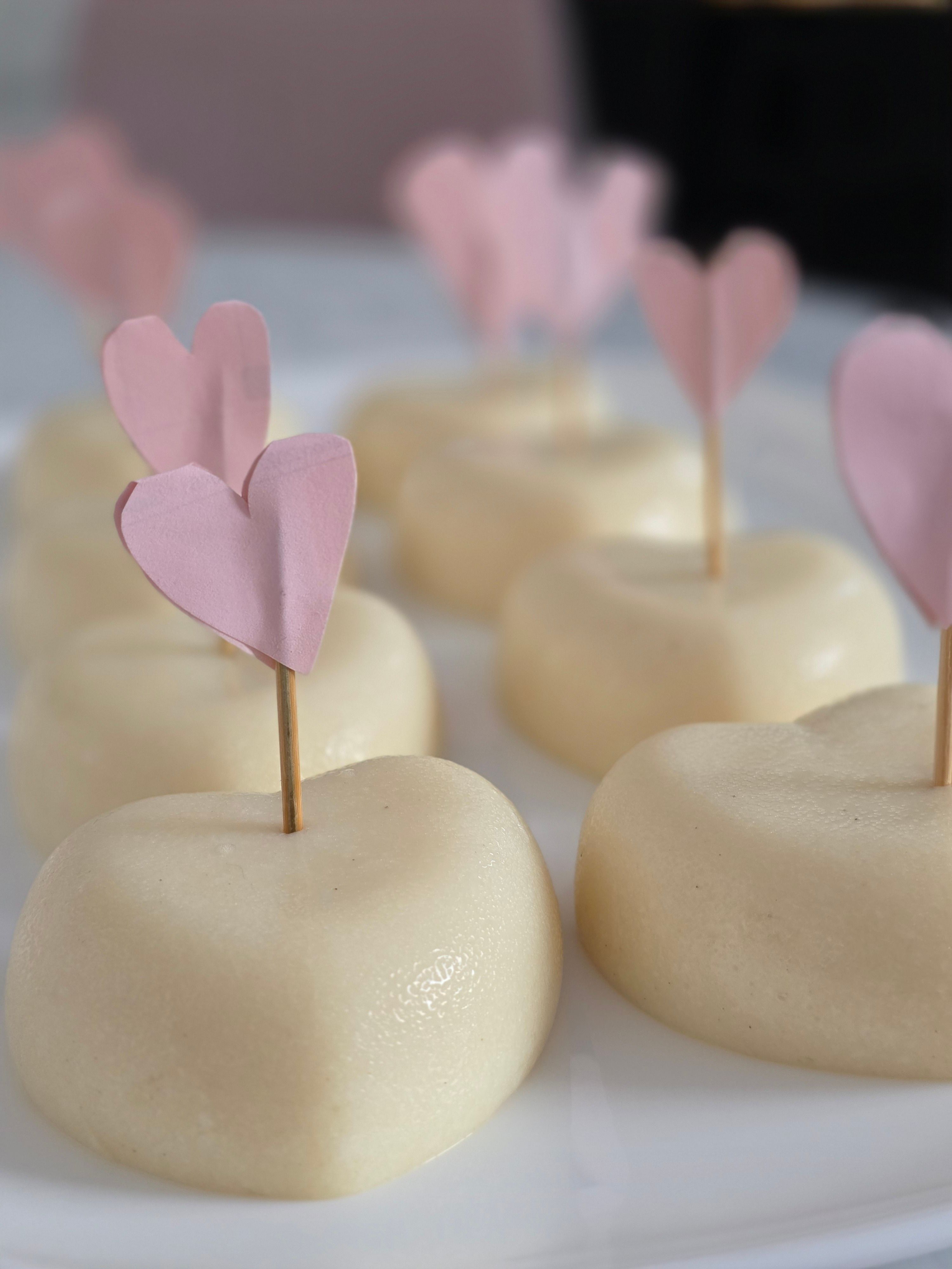 Heart-Shaped Vanilla Pudding with Pink Heart Toppers · Free Stock Photo