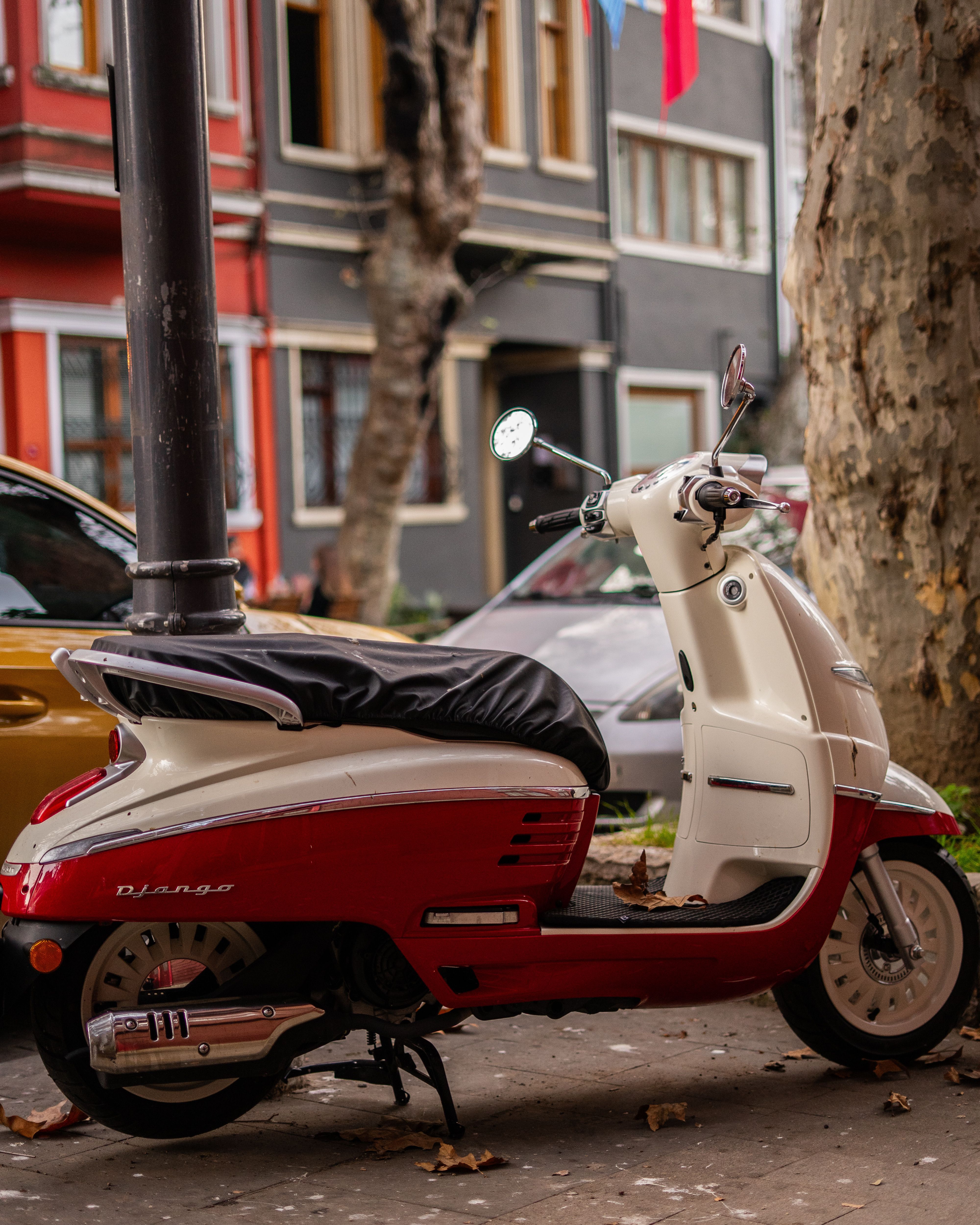 Vintage Red Scooter Parked on City Street · Free Stock Photo