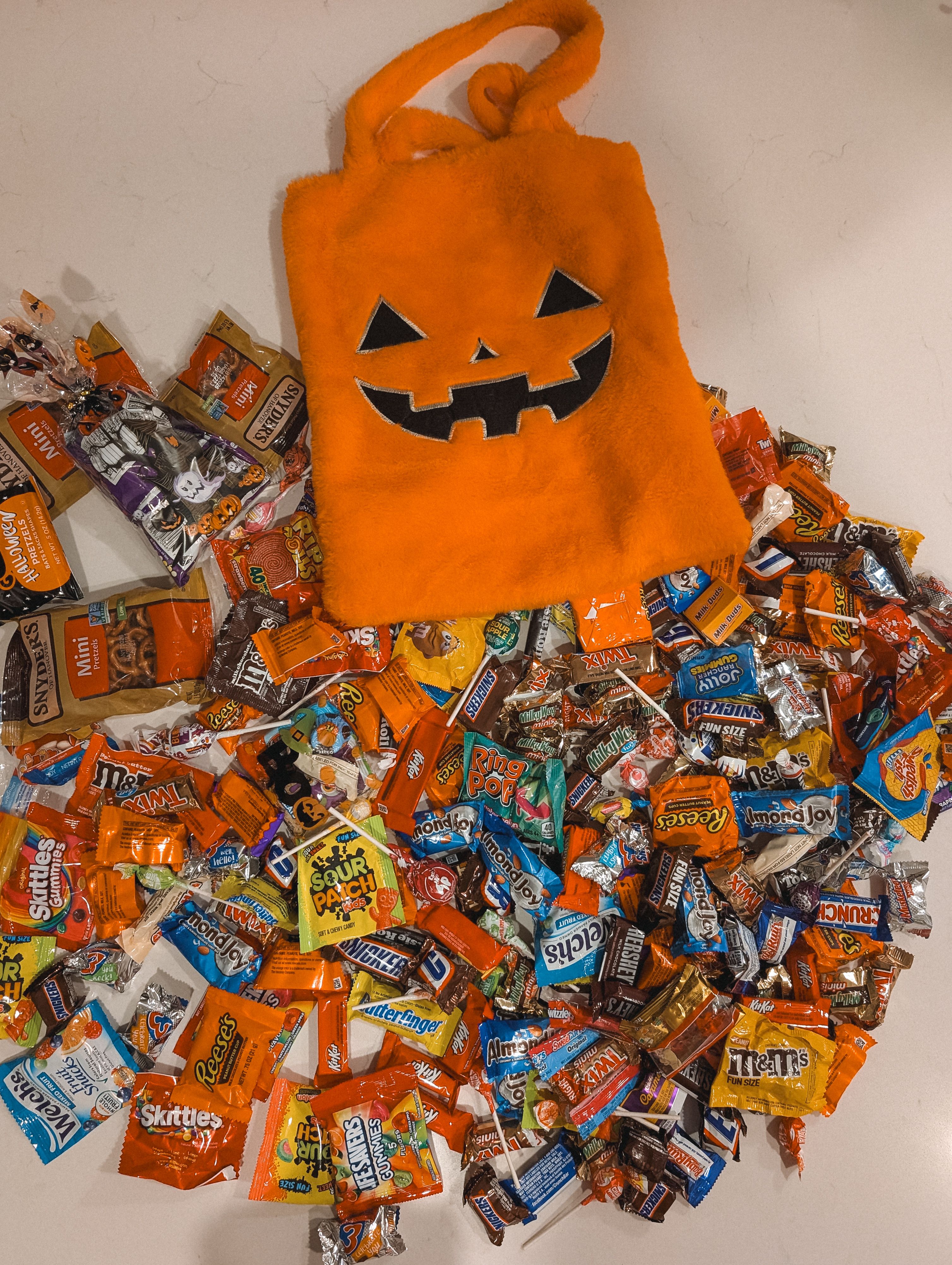 Halloween Candy Spill with Pumpkin Bag · Free Stock Photo