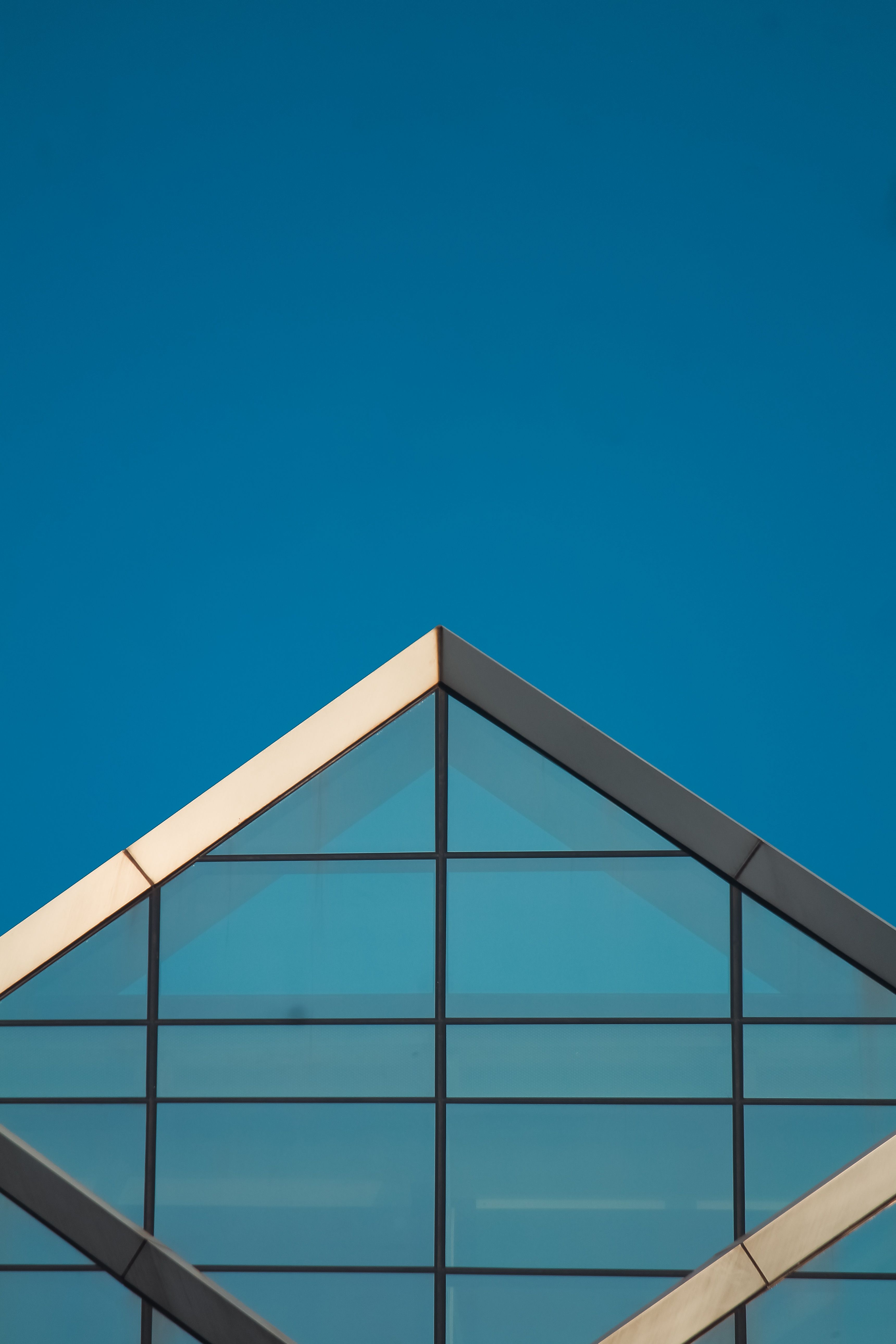 Modern Architectural Glass Roof against Blue Sky · Free Stock Photo