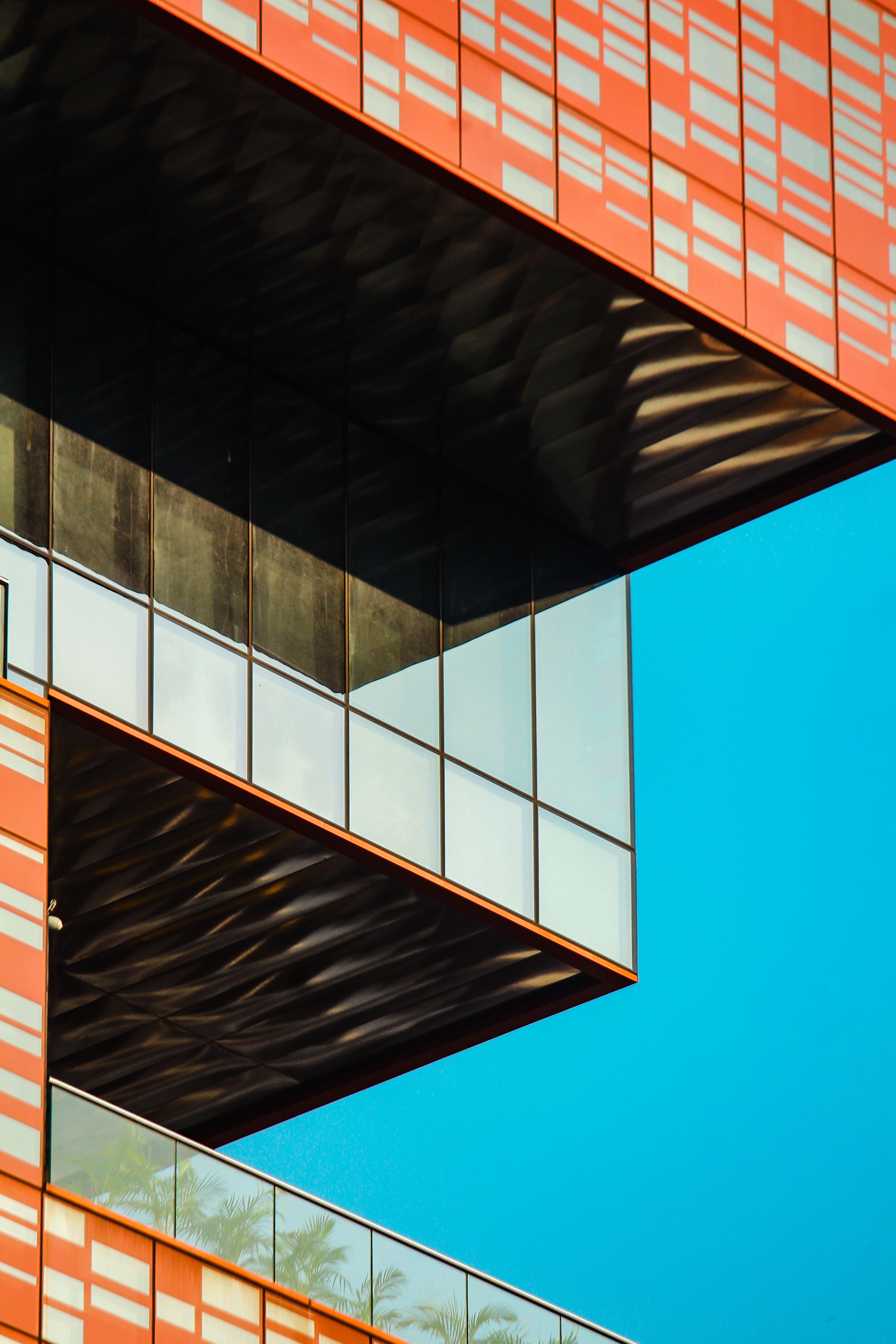 Modern Geometric Architecture Against Blue Sky · Free Stock Photo