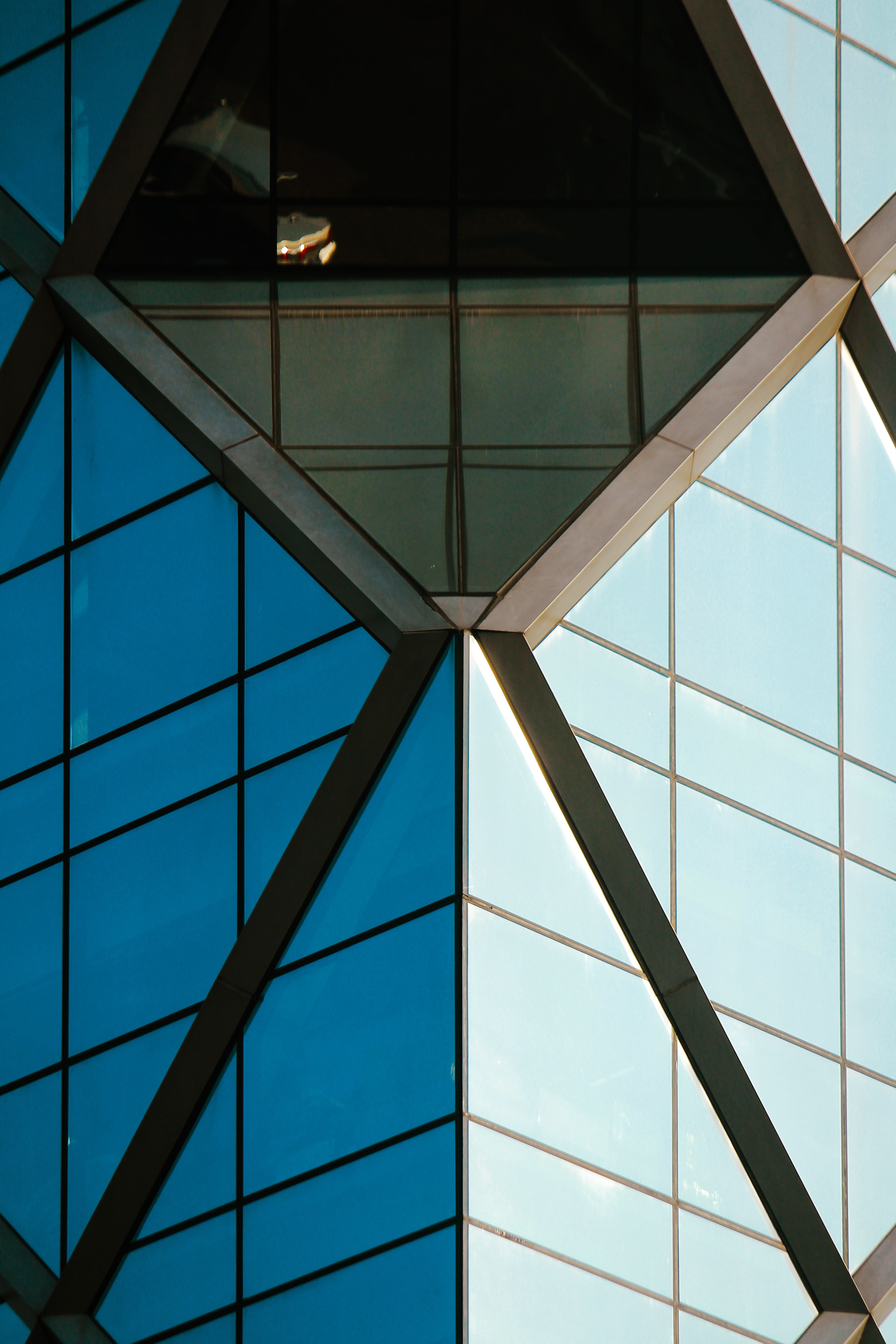 Modern Geometric Glass Building Facade · Free Stock Photo