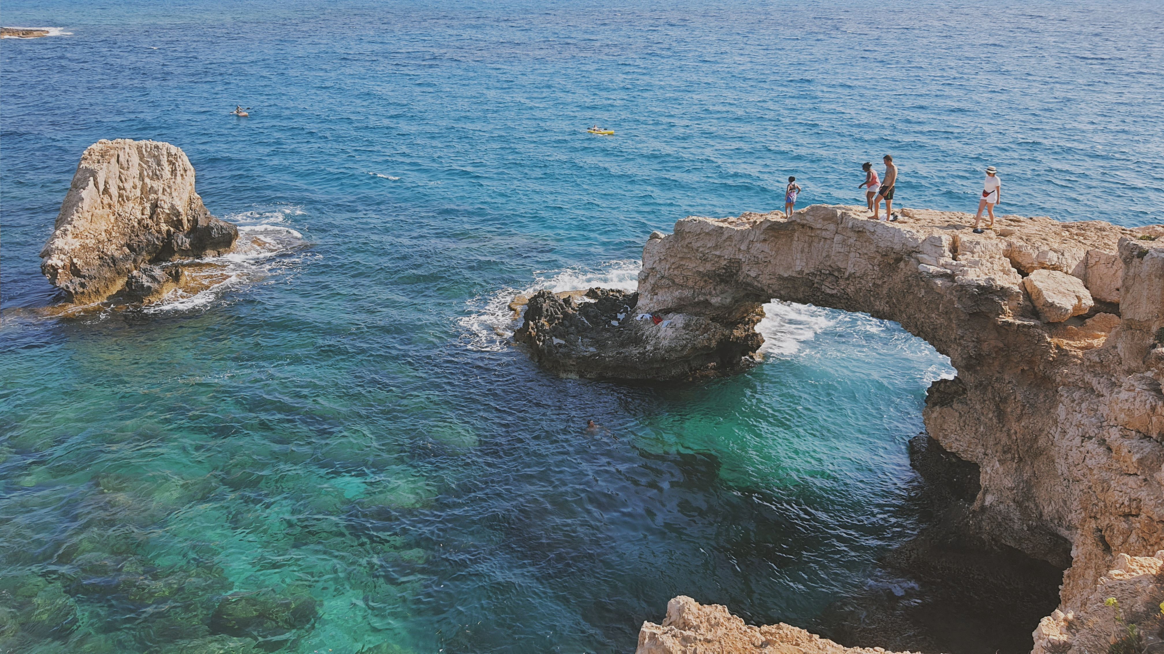 Scenic Coastal Arch in Cyprus with Tourists · Free Stock Photo