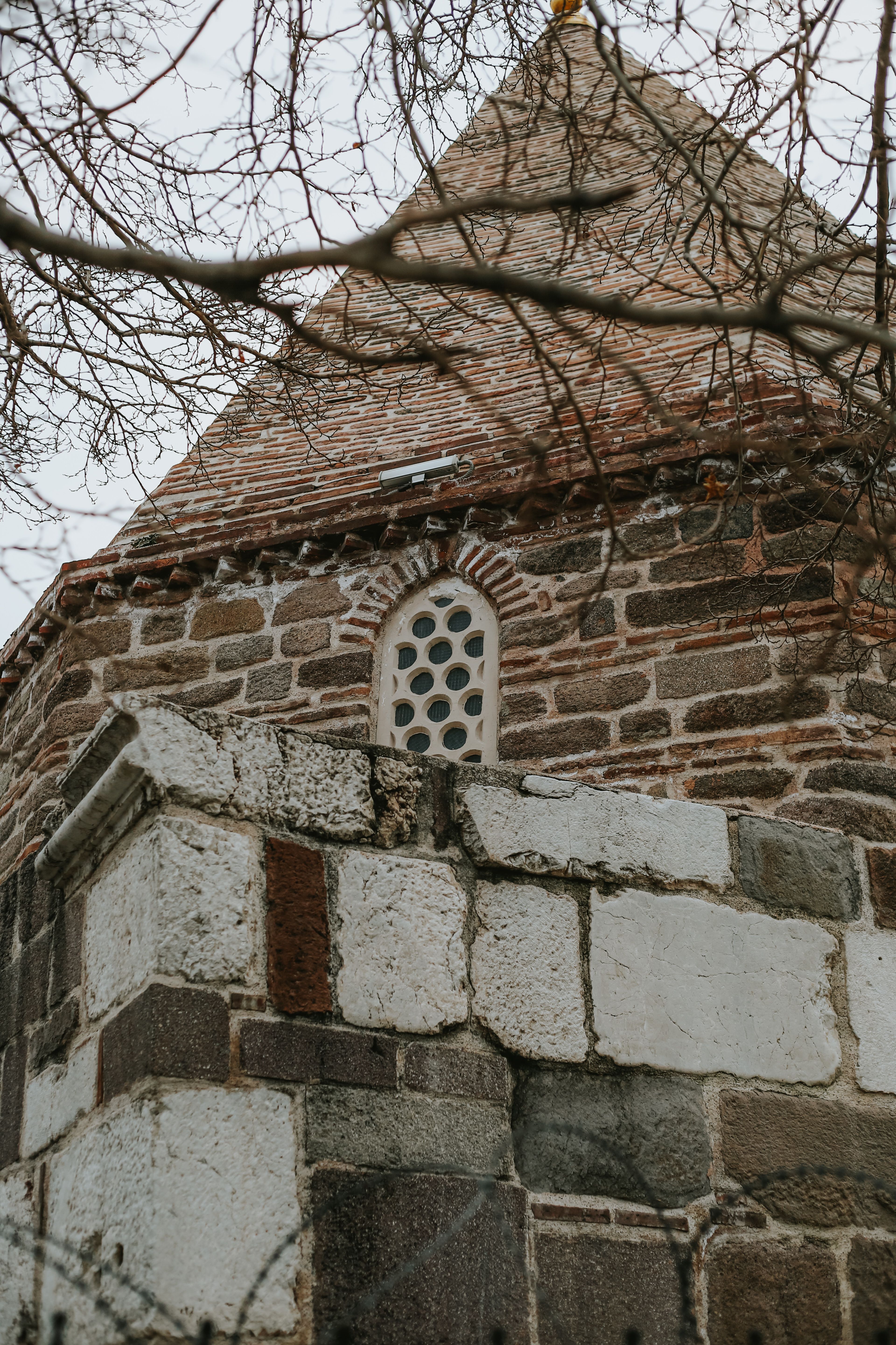 Historic Brick Tower with Unique Window Design · Free Stock Photo