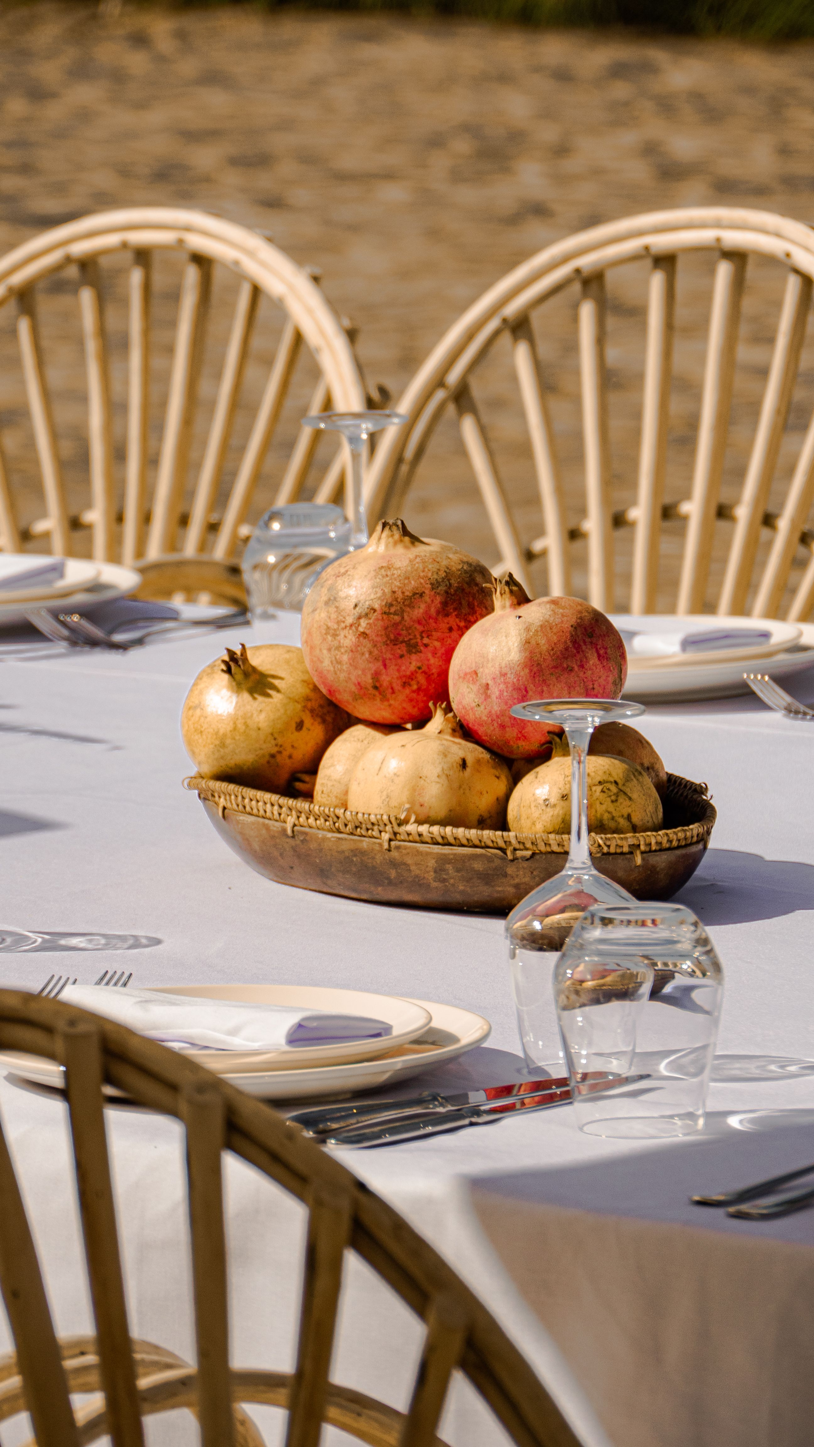 Elegant Outdoor Dining with Pomegranates · Free Stock Photo