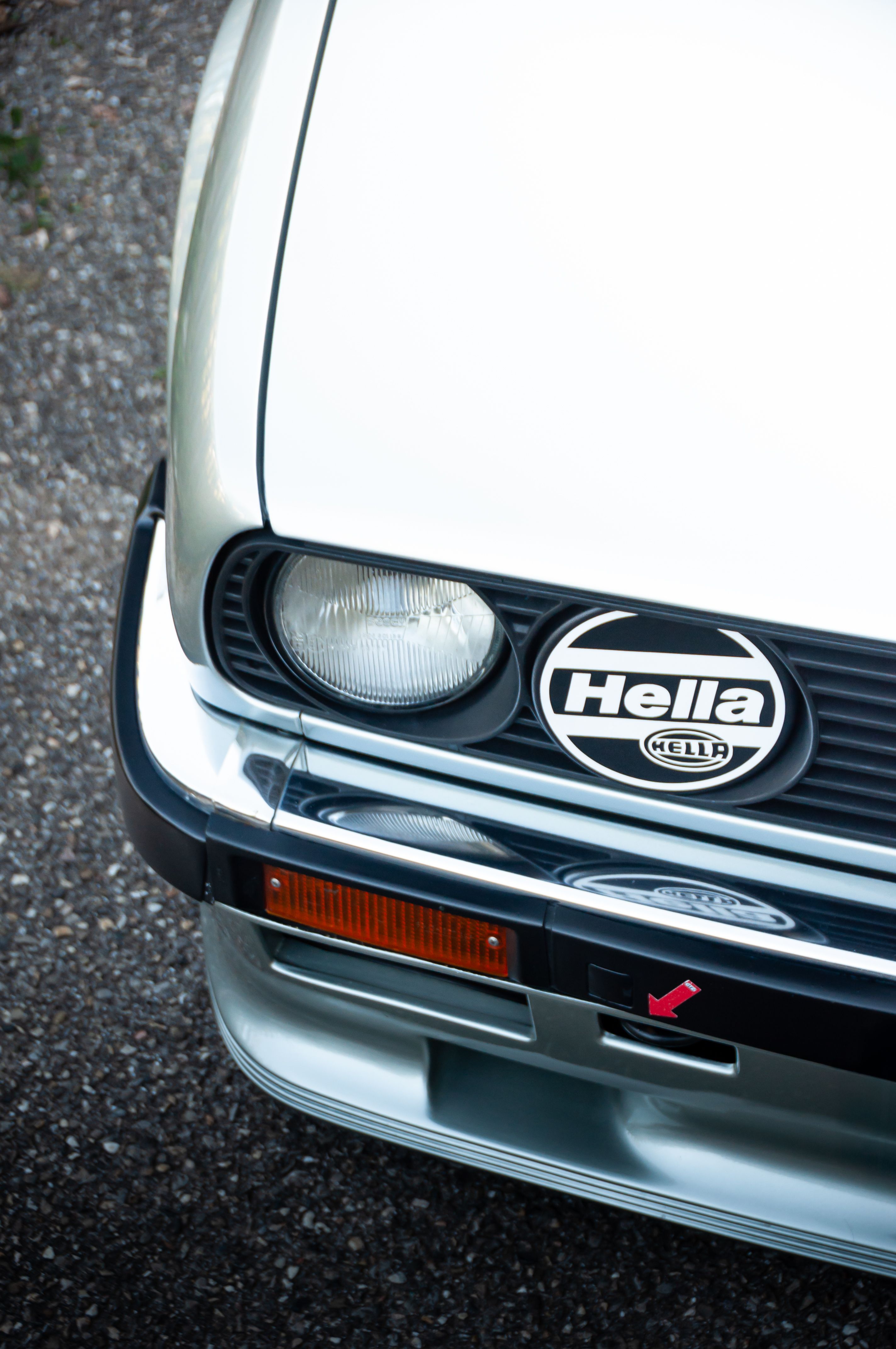 Close-up of Vintage Car Grille with Hella Logo · Free Stock Photo