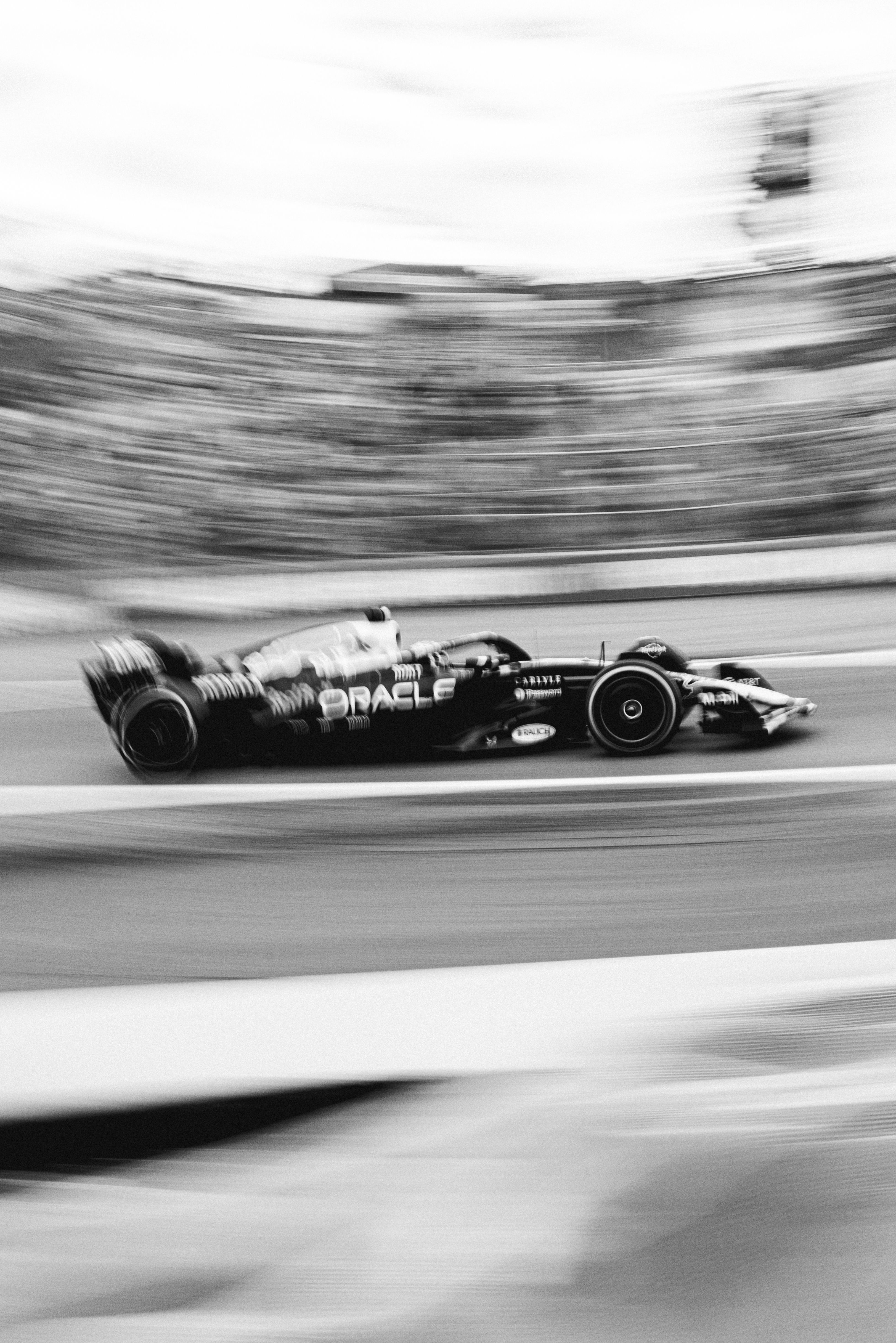 Dynamic Black and White Formula 1 Race Car Motion · Free Stock Photo
