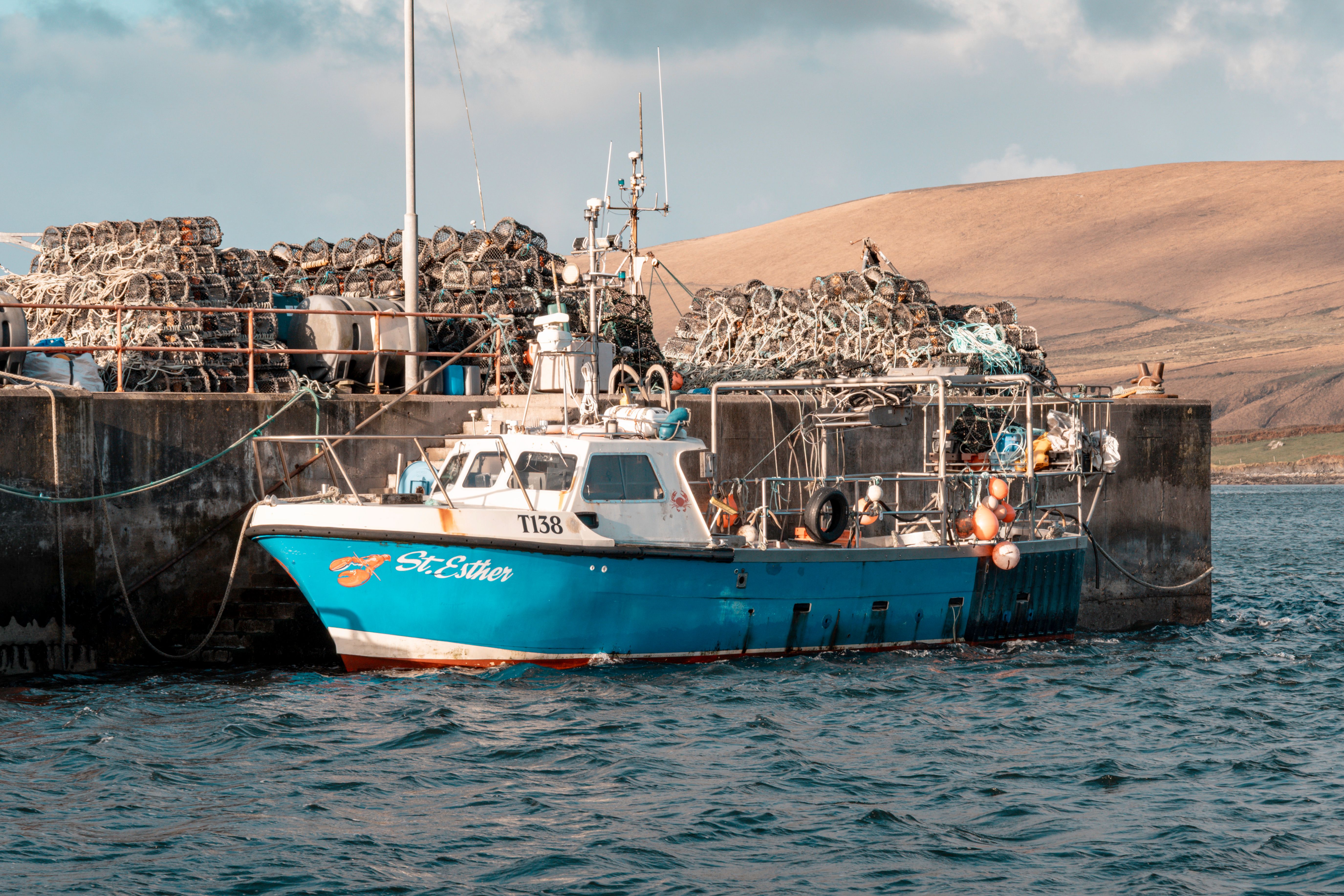 Irish Fishing Boat Docked at Scenic Port · Free Stock Photo