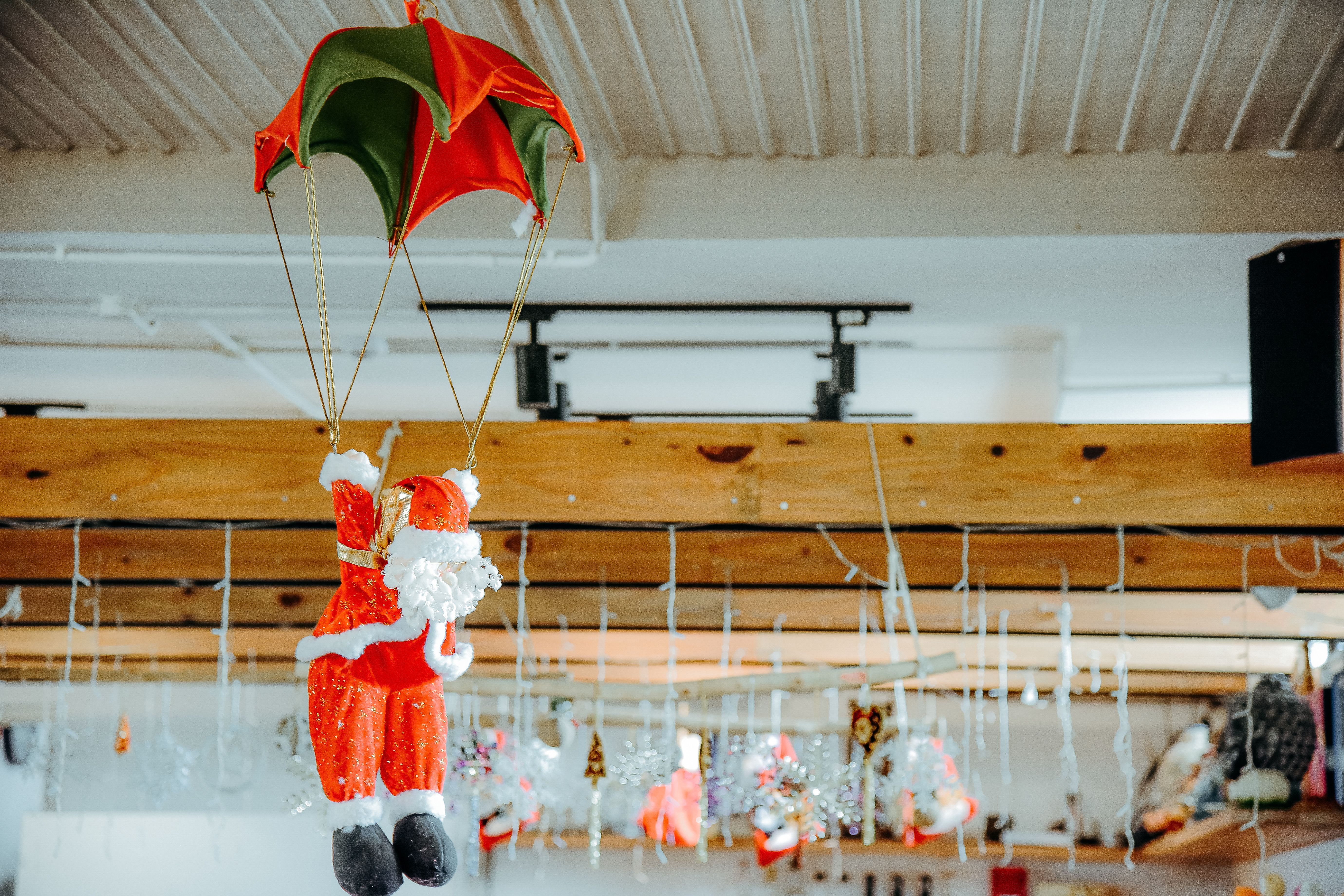 Festive Santa Claus Ornament With Parachute Indoors · Free Stock Photo