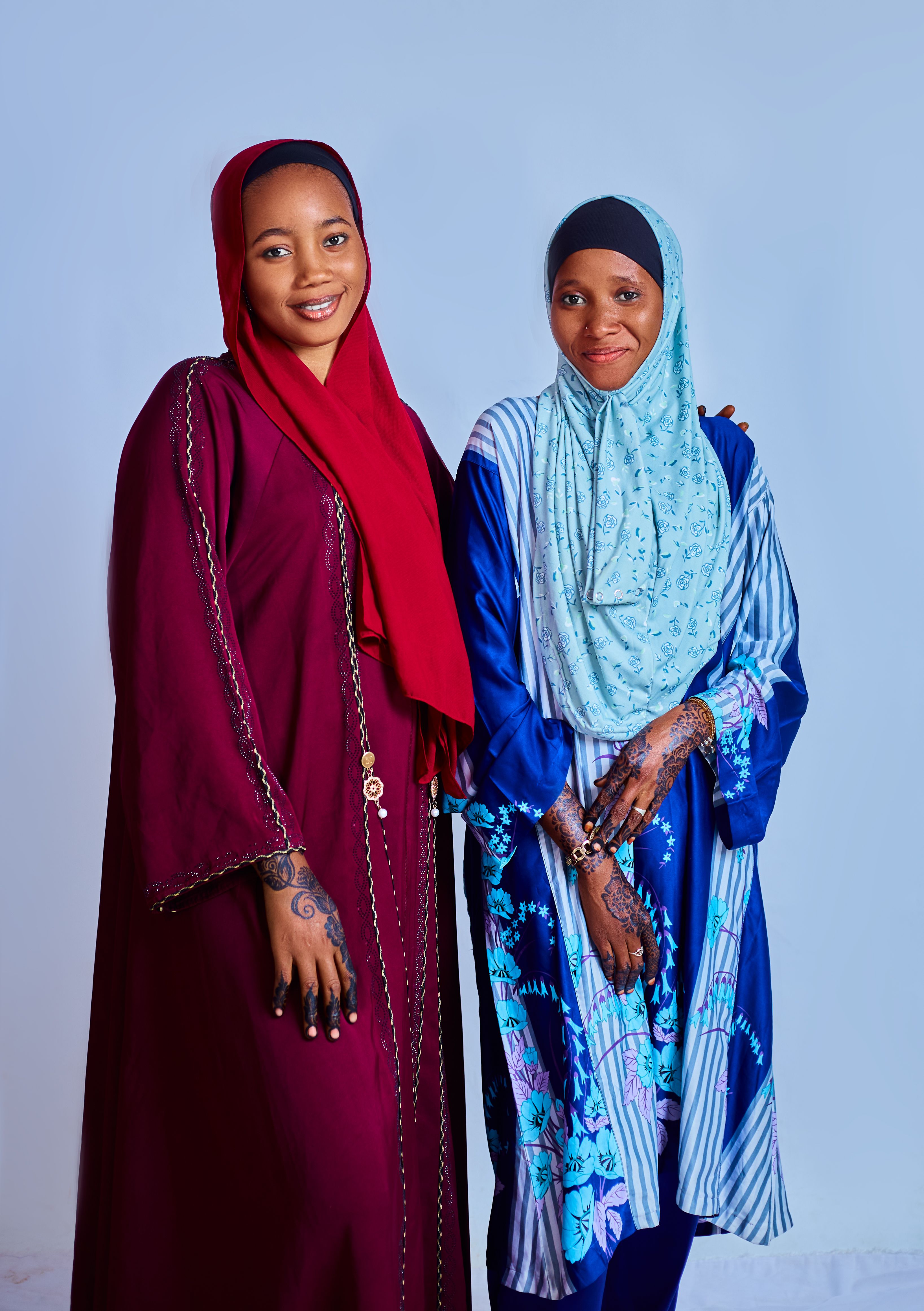 Portrait of Two Women in Colorful Hijabs Smiling · Free Stock Photo