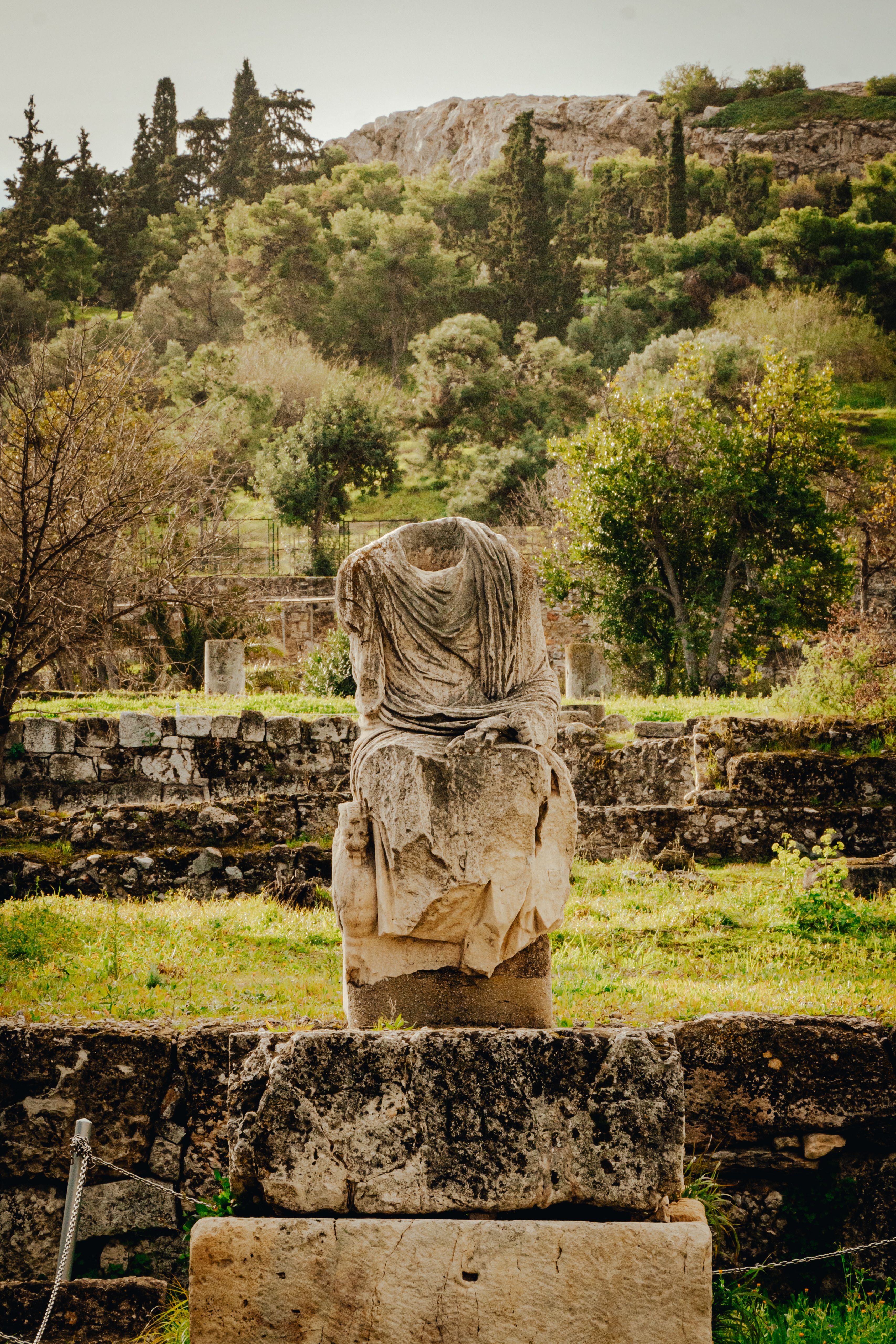 Ancient Greek Ruins with Headless Statue · Free Stock Photo