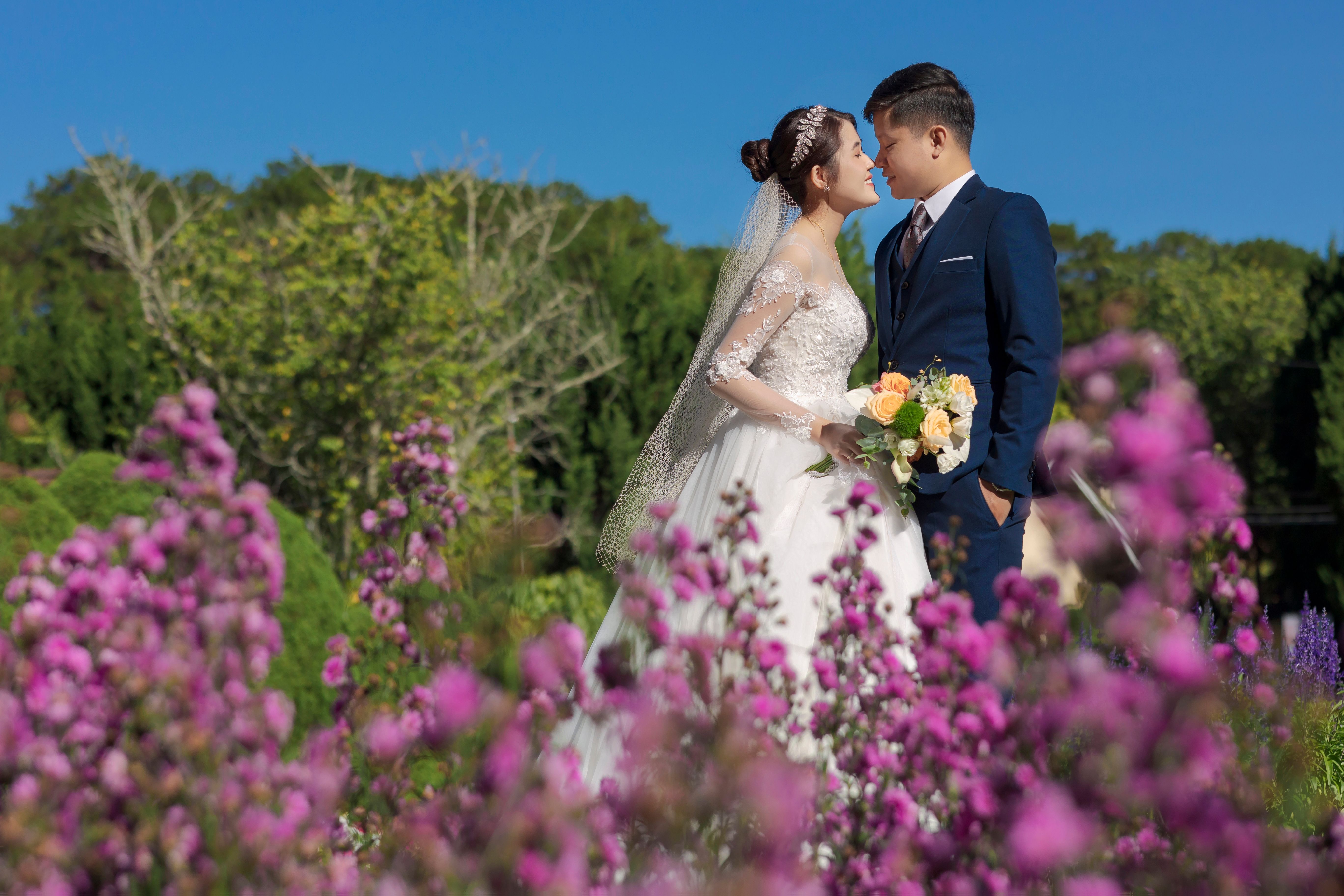 Romantic Outdoor Wedding Portrait in Blooming Garden · Free Stock Photo