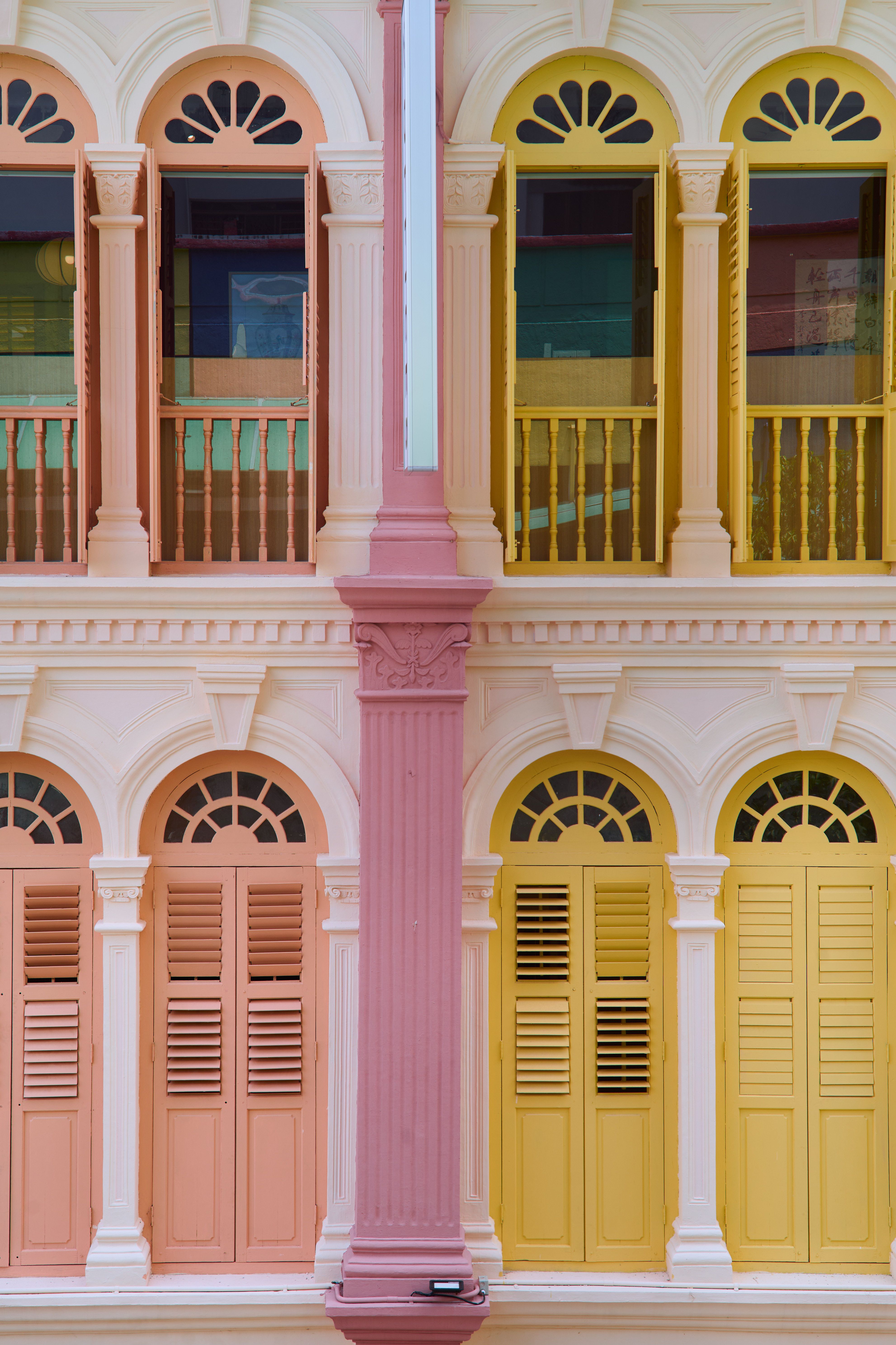 Colorful Colonial Architecture with Arched Windows · Free Stock Photo