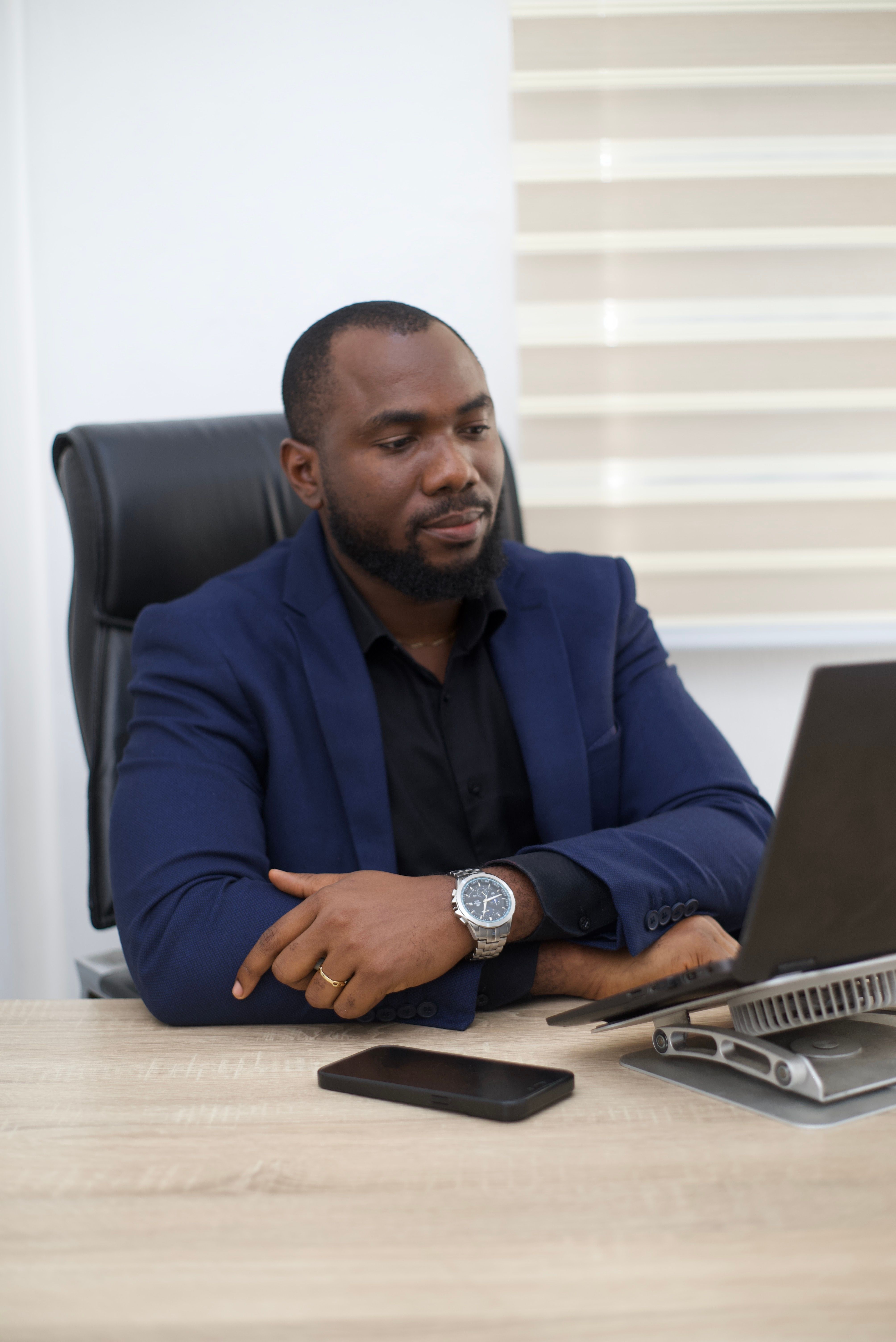 African Executive Arranging Folders Photos, Download The BEST Free ...