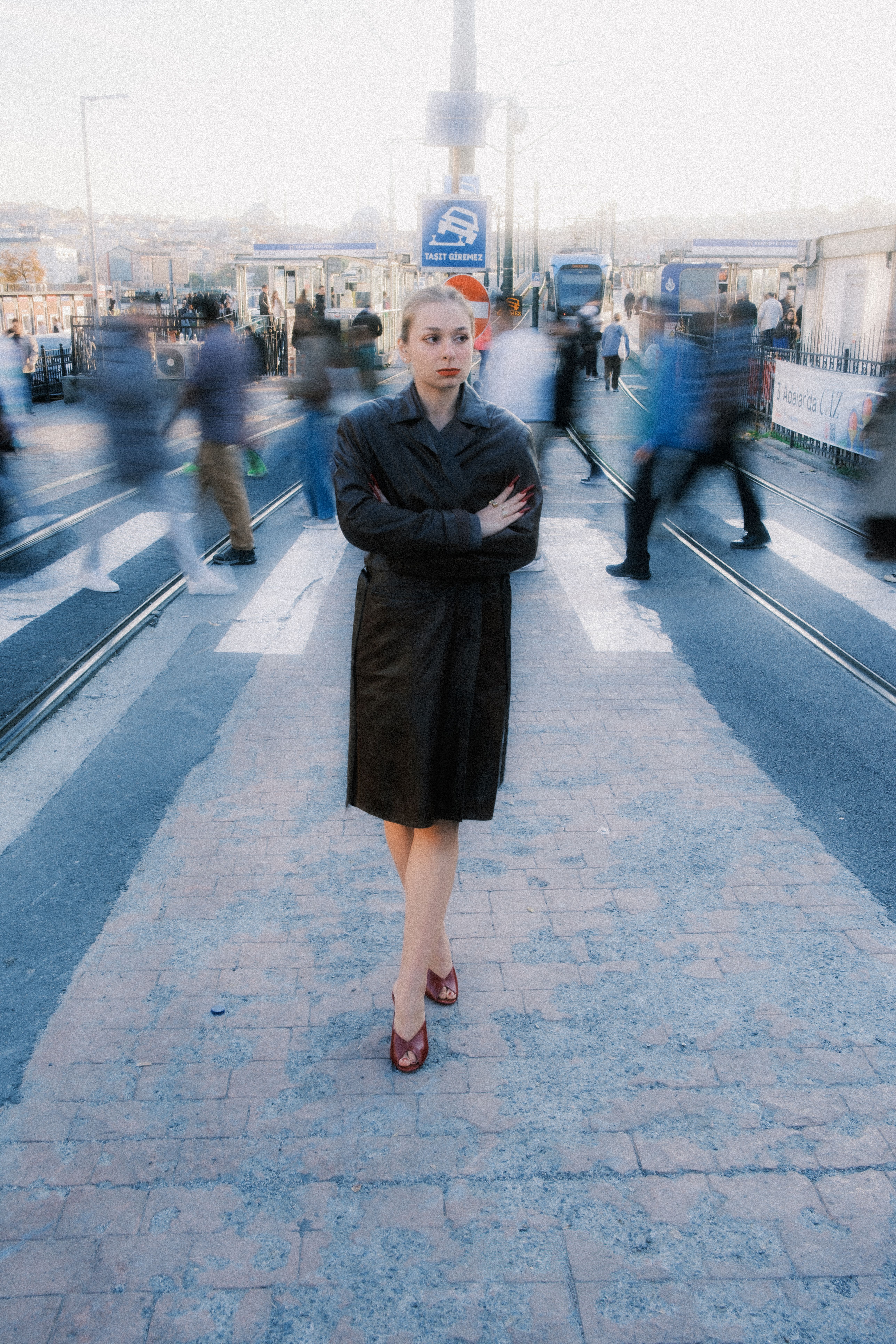 Woman Standing Still as Crowd Blurs Around Her · Free Stock Photo