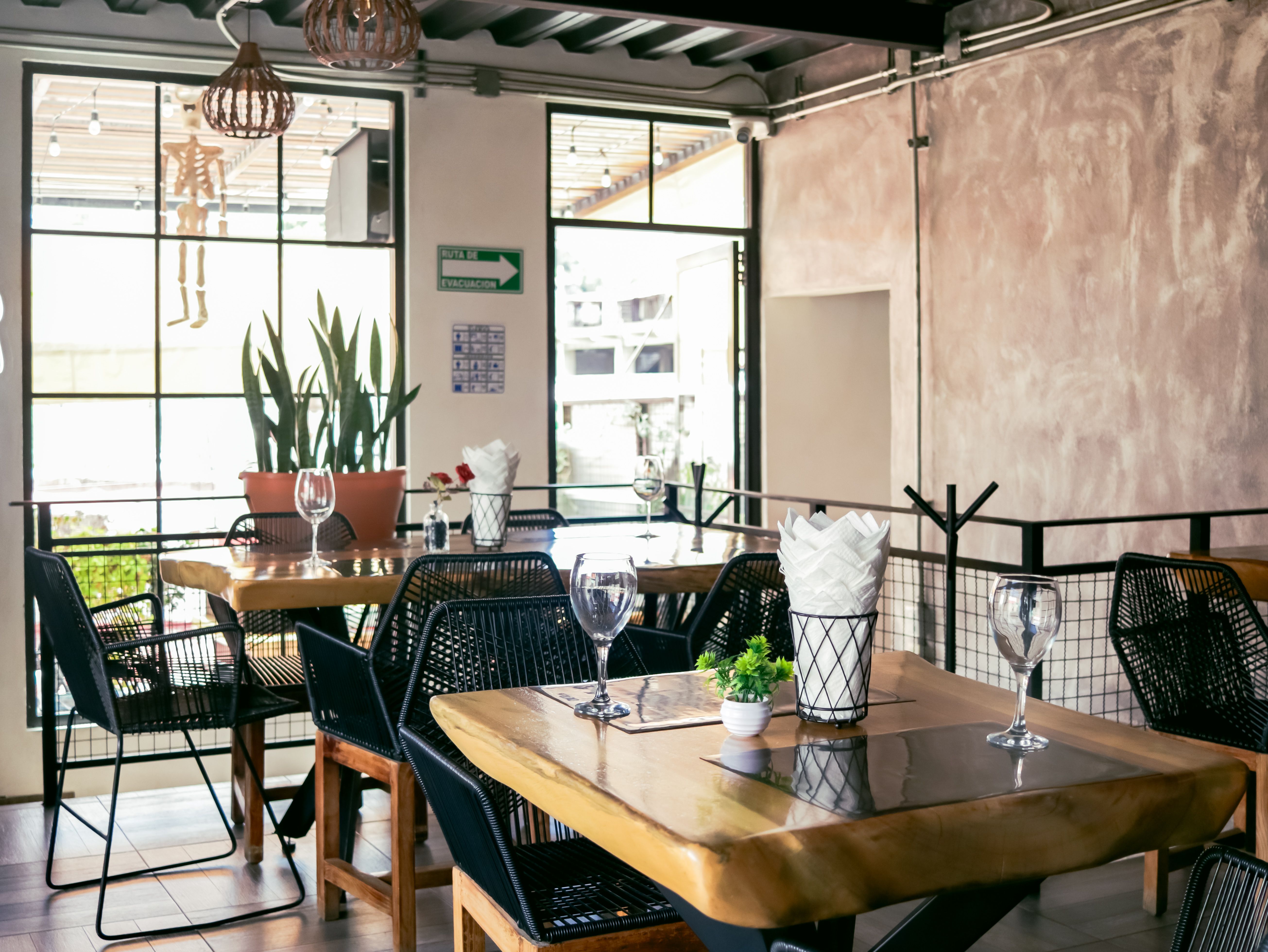 Cozy Modern Restaurant Interior with Natural Light · Free Stock Photo
