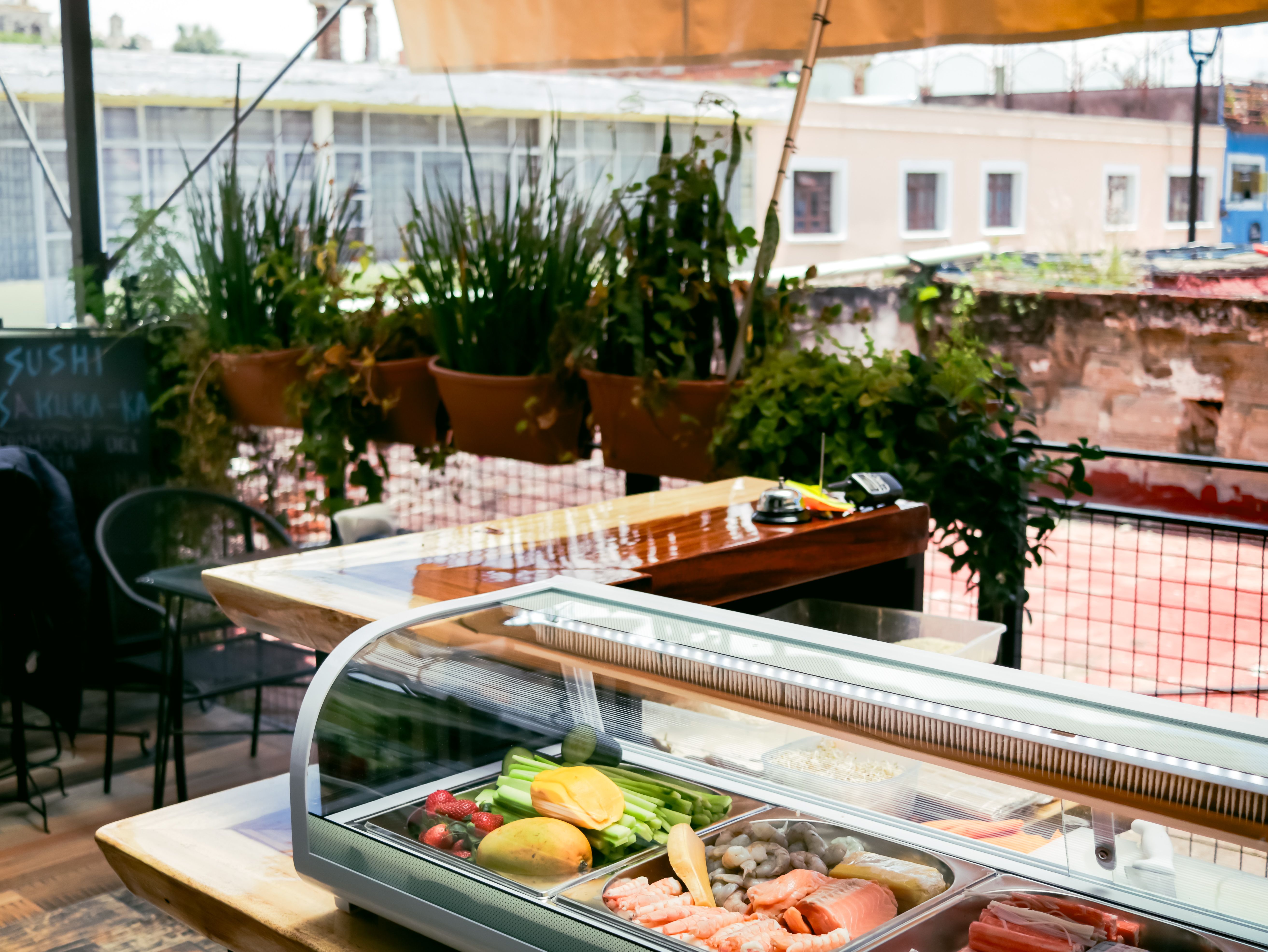 Outdoor Sushi Bar with Fresh Ingredients Display · Free Stock Photo