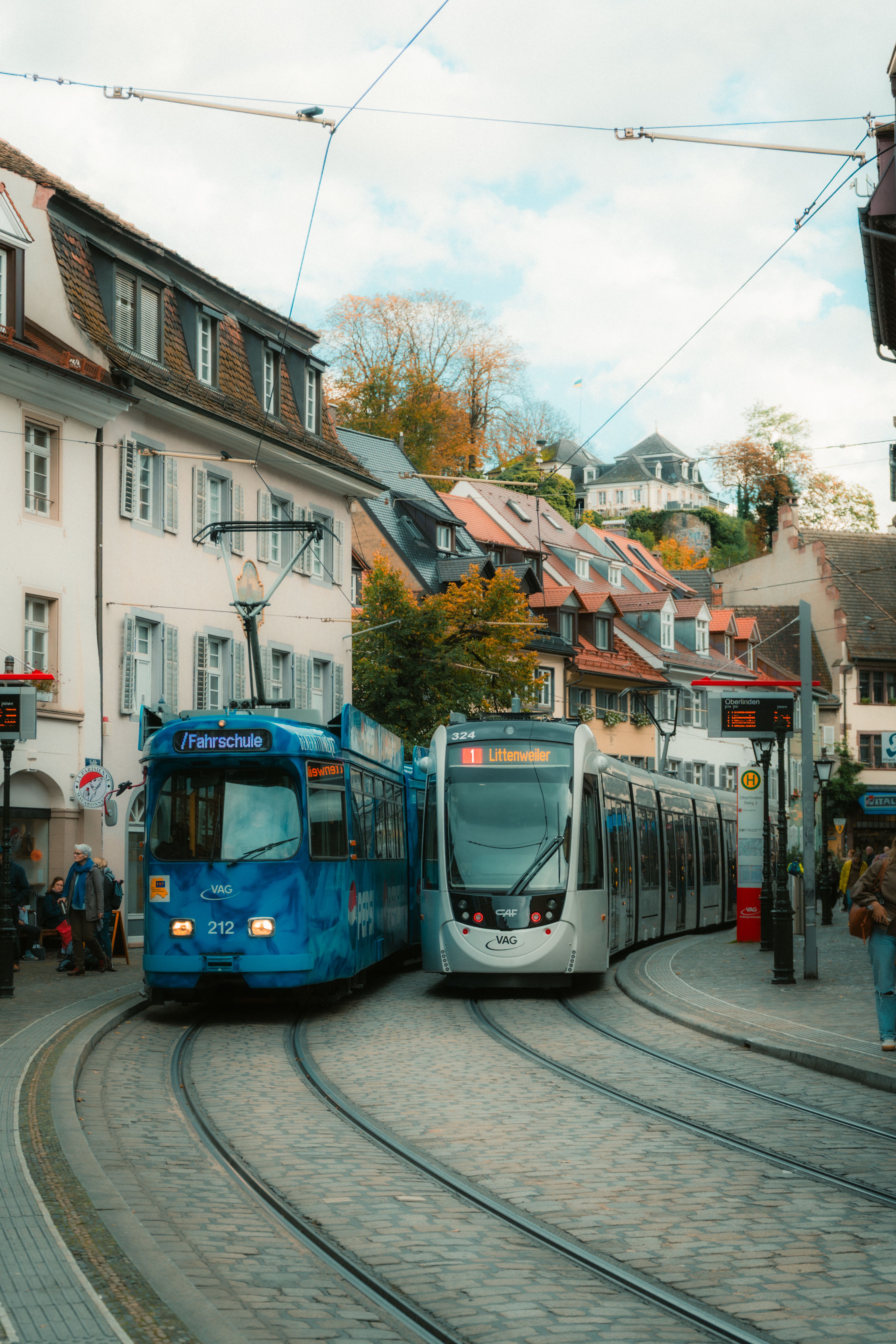 City Trams in Freiburg's Scenic Street · Free Stock Photo