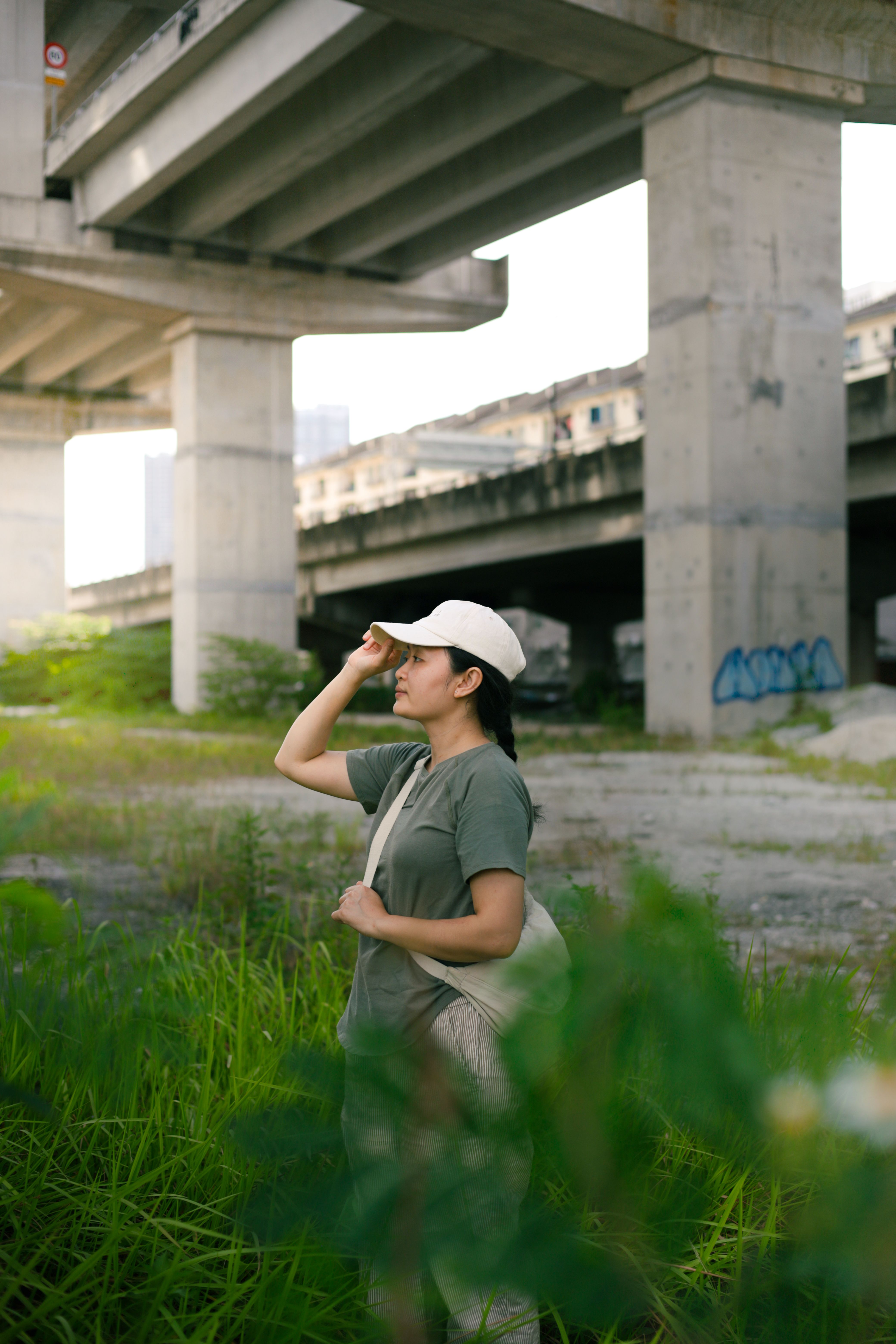 Woman Exploring Urban Underpass Landscape · Free Stock Photo