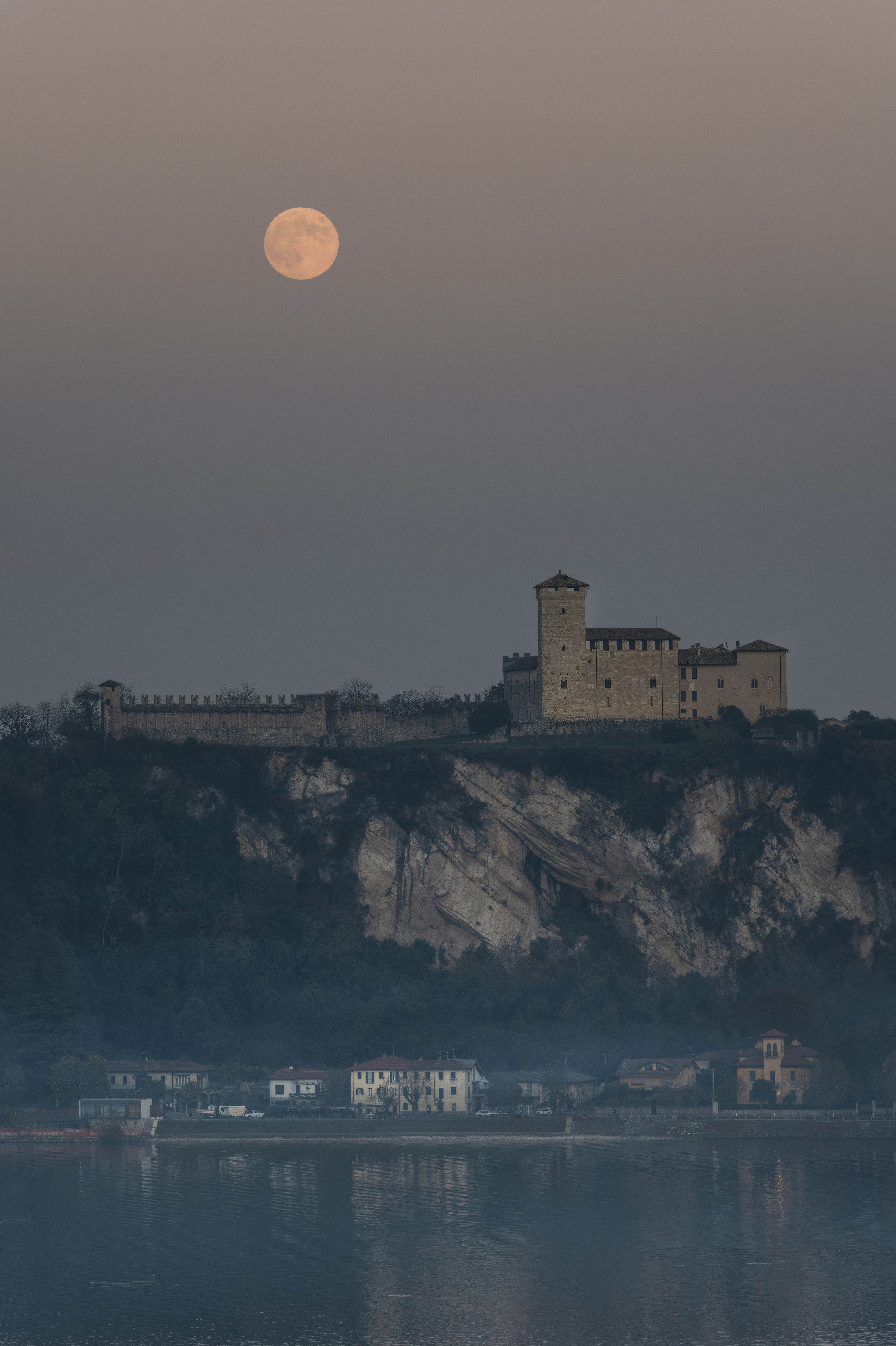 Castle Overlooking Lake with Full Moon at Twilight · Free Stock Photo