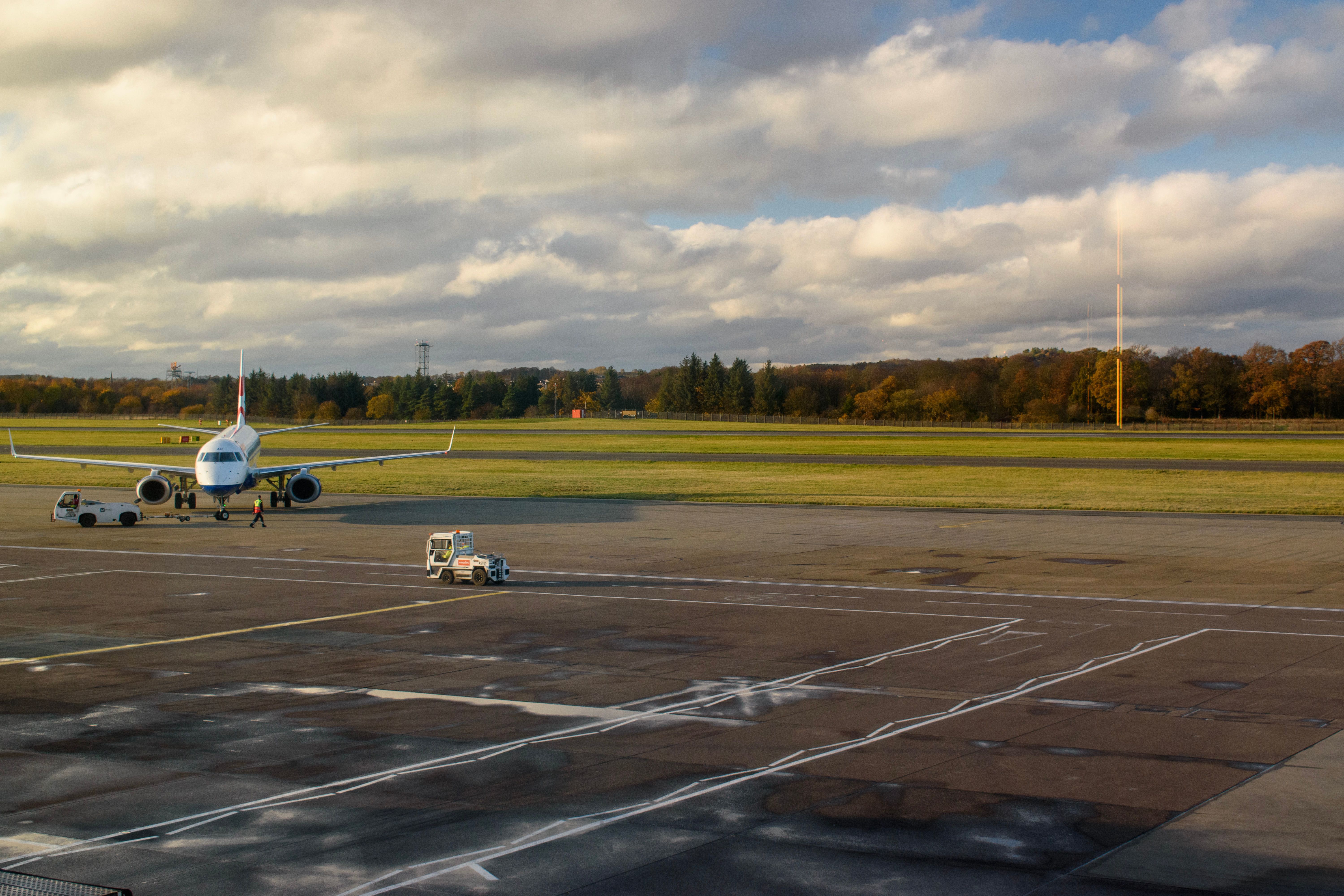 Commercial Airplane on Tarmac During Autumn Day · Free Stock Photo