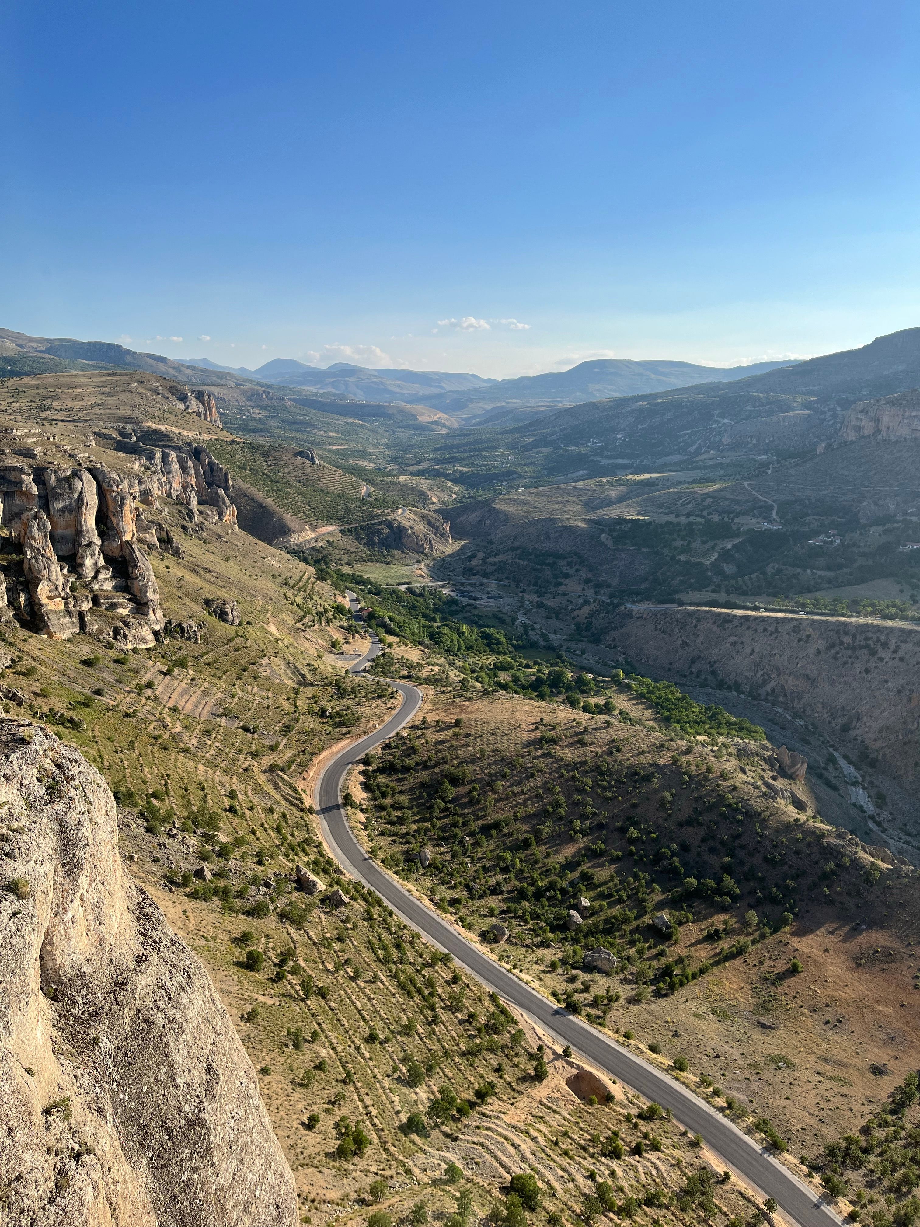 Scenic Mountain Road with Rocky Cliffs · Free Stock Photo