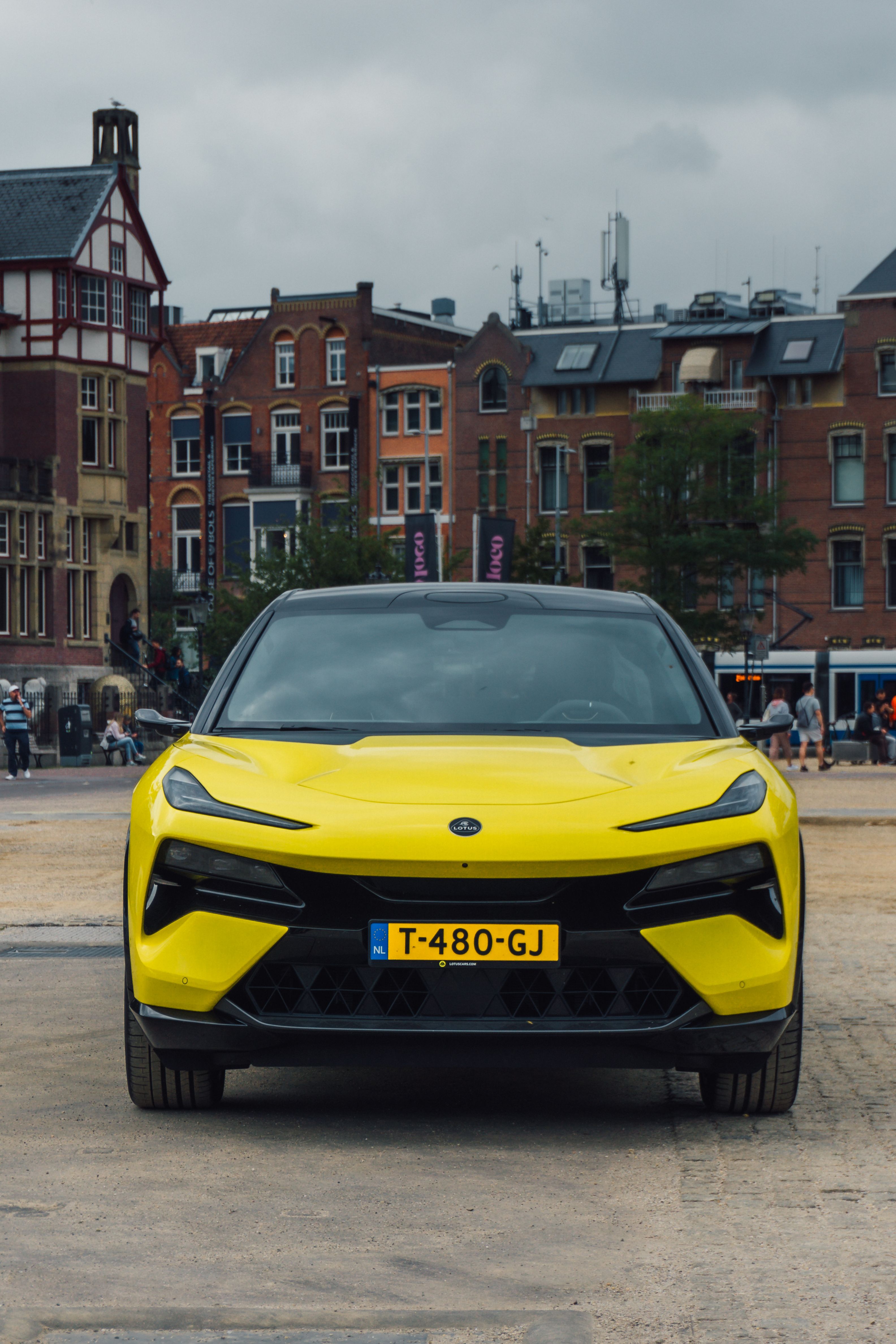 Vibrant Yellow Sports Car in Urban Setting · Free Stock Photo