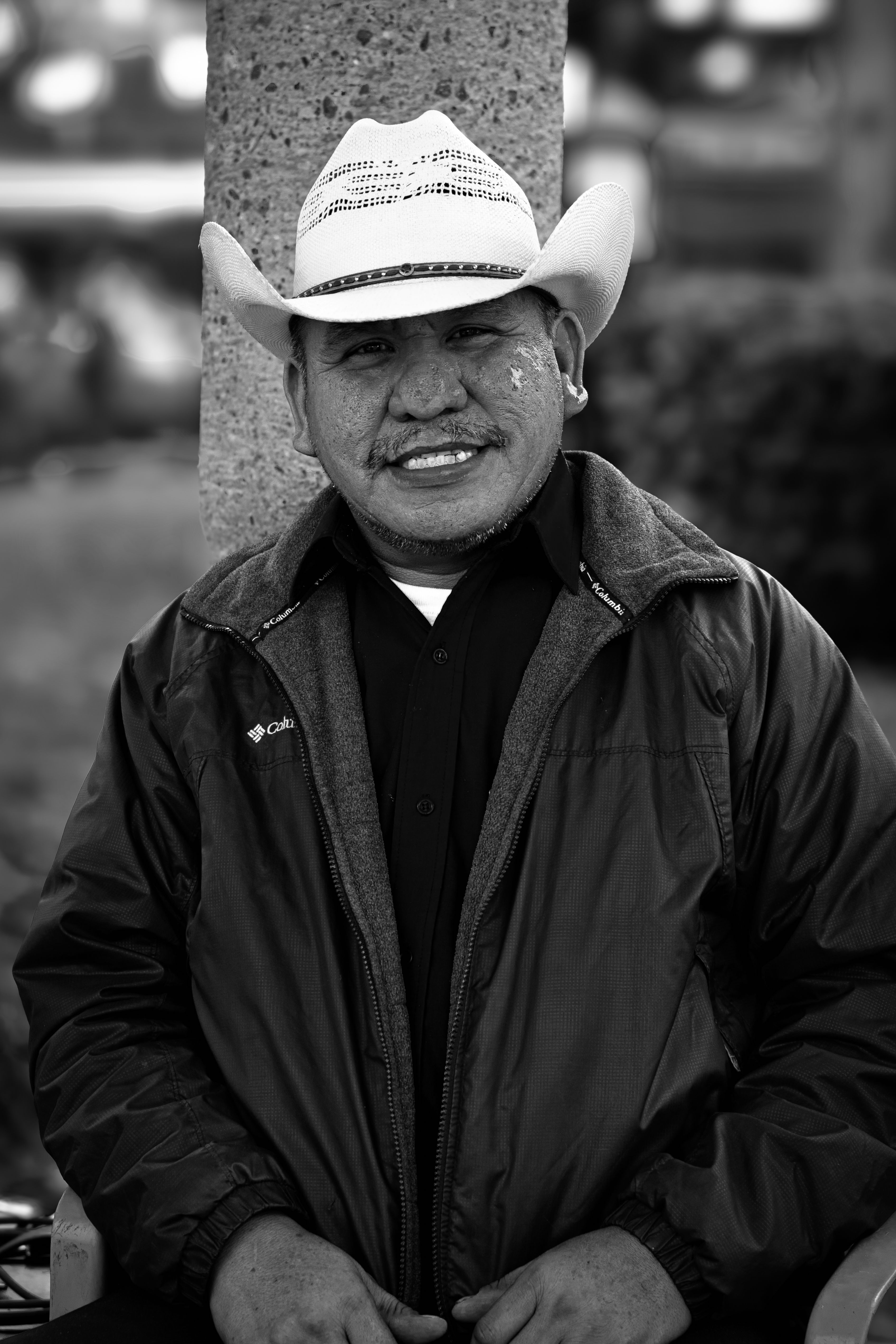 Black and White Portrait of Smiling Cowboy · Free Stock Photo