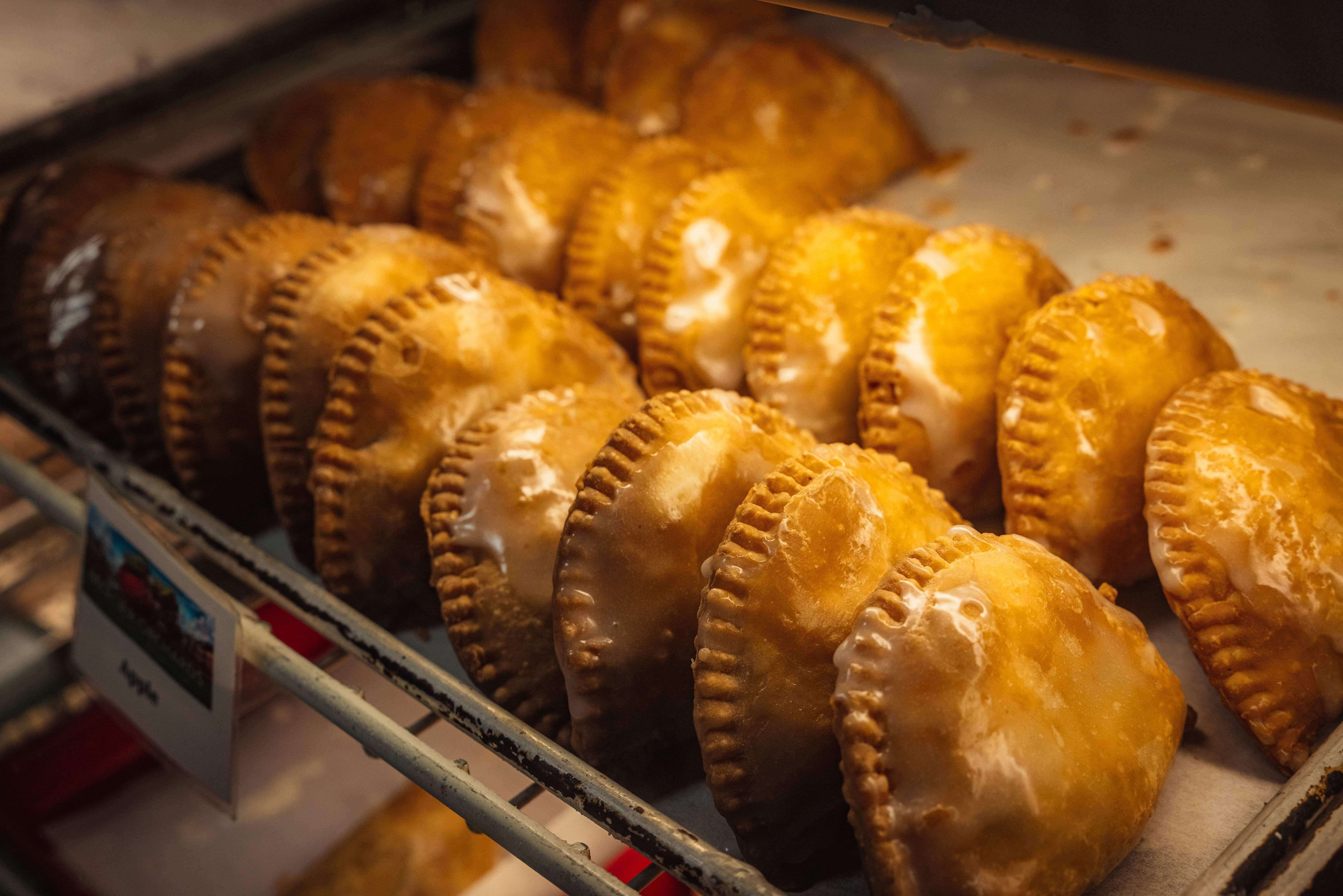 Golden Homemade Hand Pies in a Bakery Display · Free Stock Photo