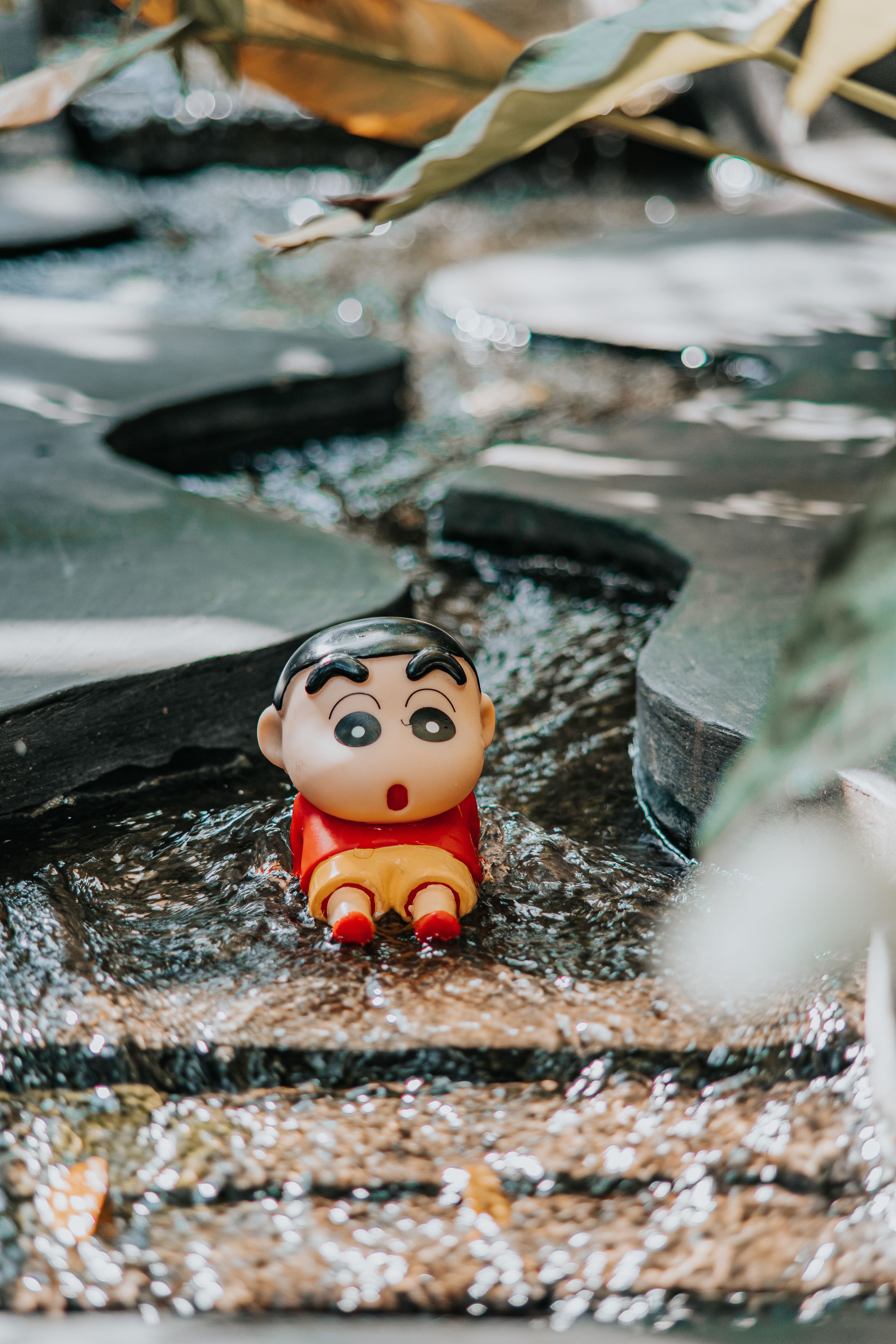 Cute Toy on Stream with Natural Surroundings · Free Stock Photo