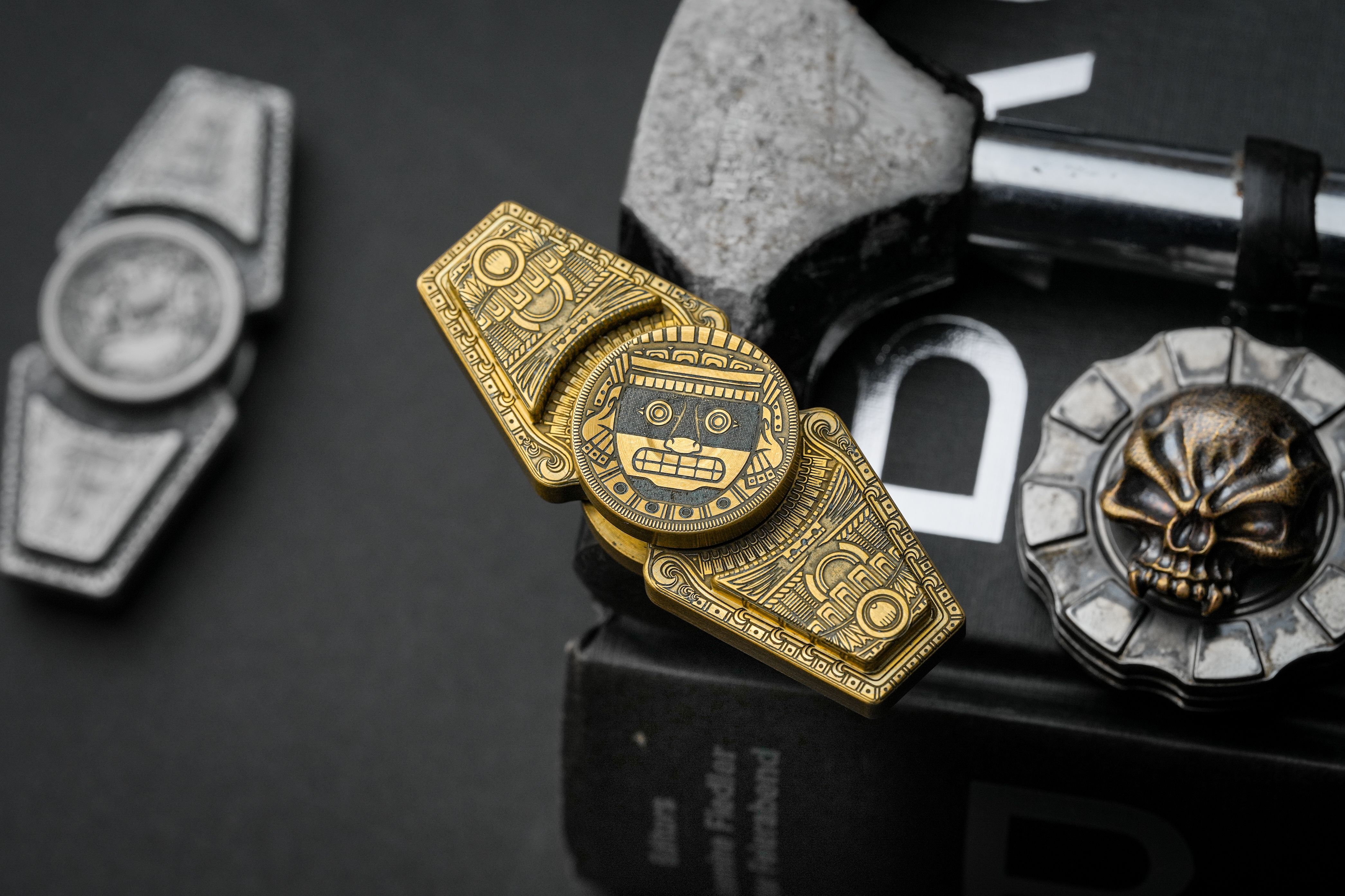 Close-Up of Metallic Aztec-Inspired Fidget Toy · Free Stock Photo