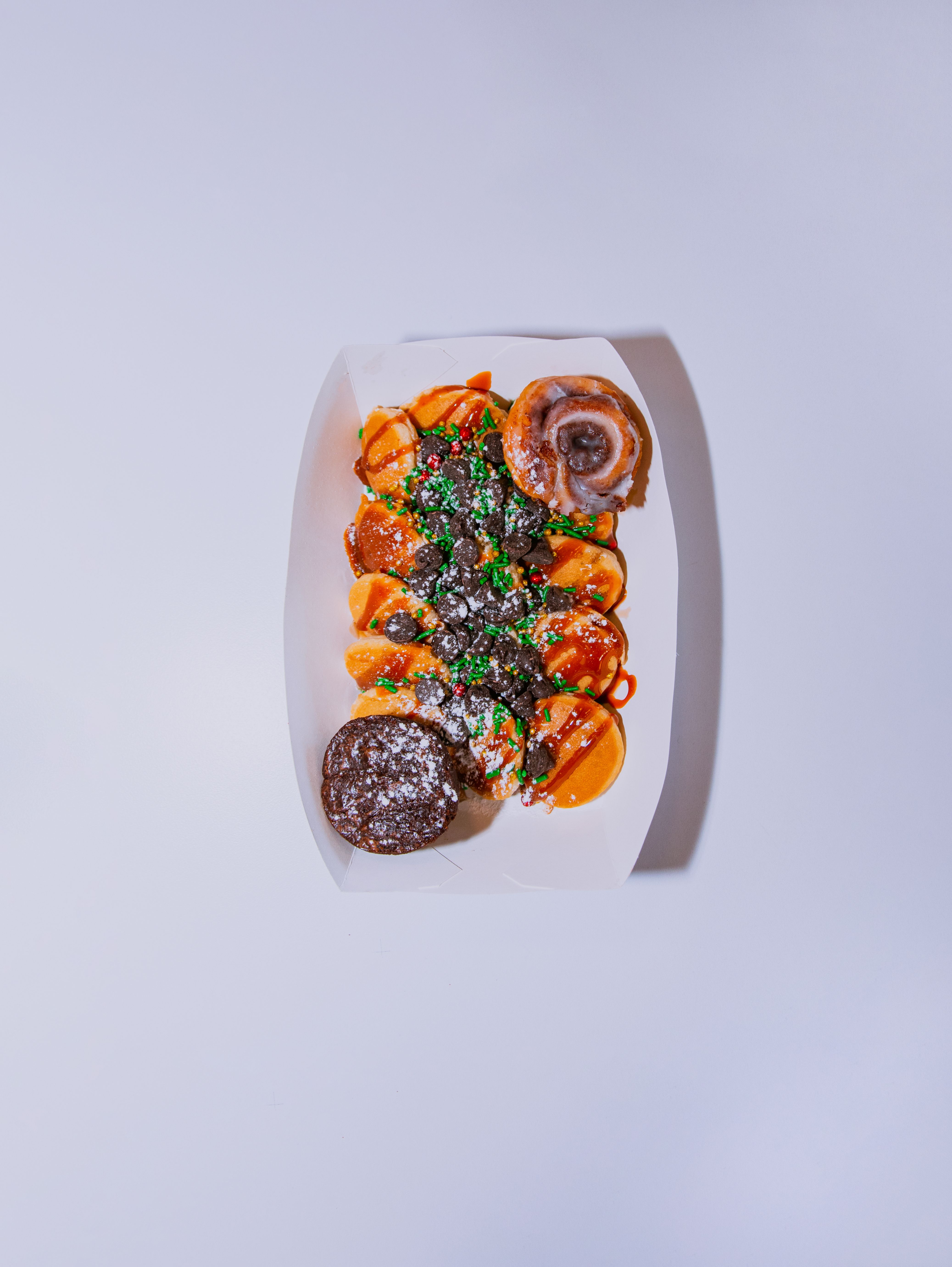 Colorful Dessert Assortment in White Tray · Free Stock Photo