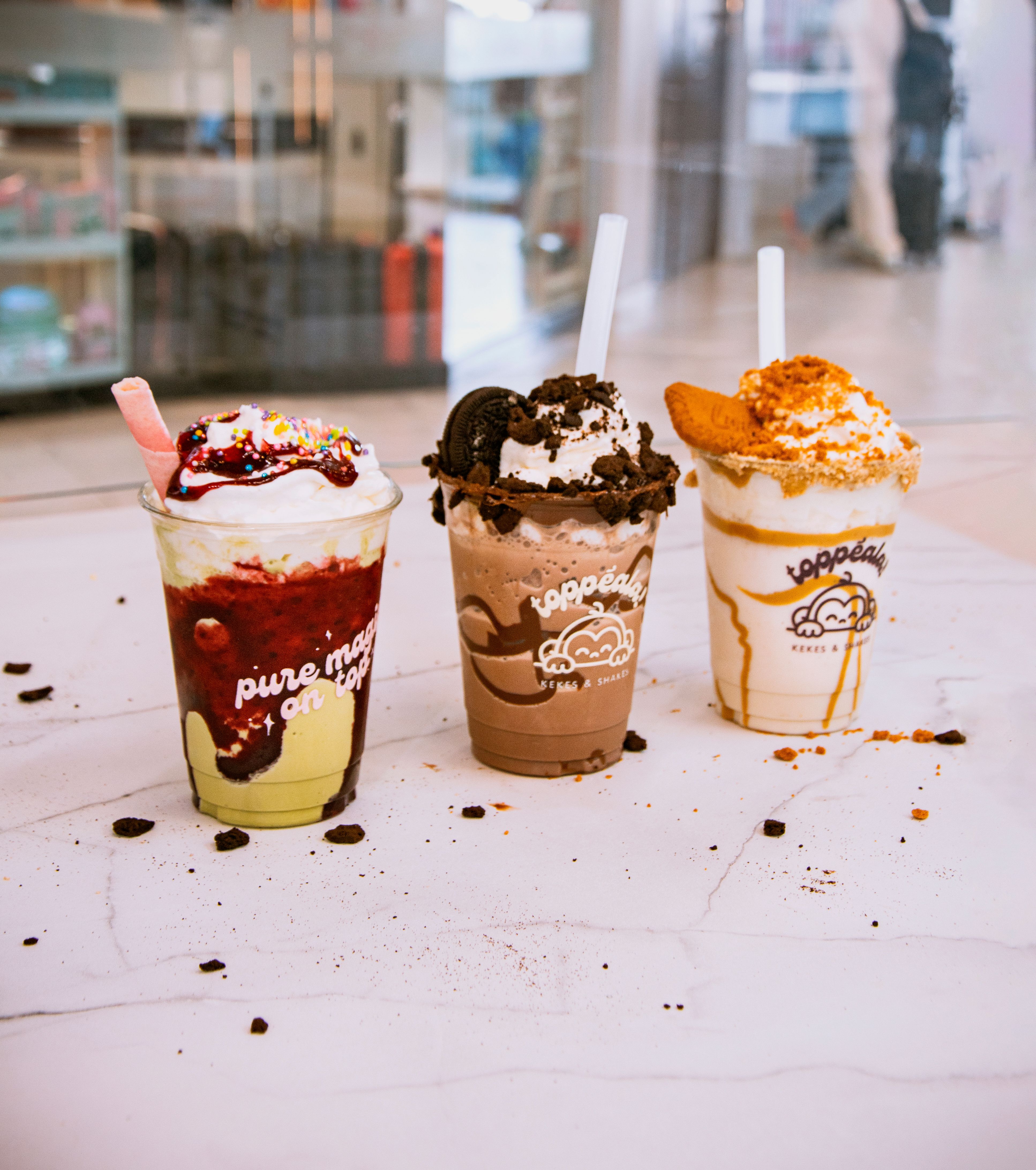 Colorful Gourmet Milkshakes Indulgence in Cafe · Free Stock Photo