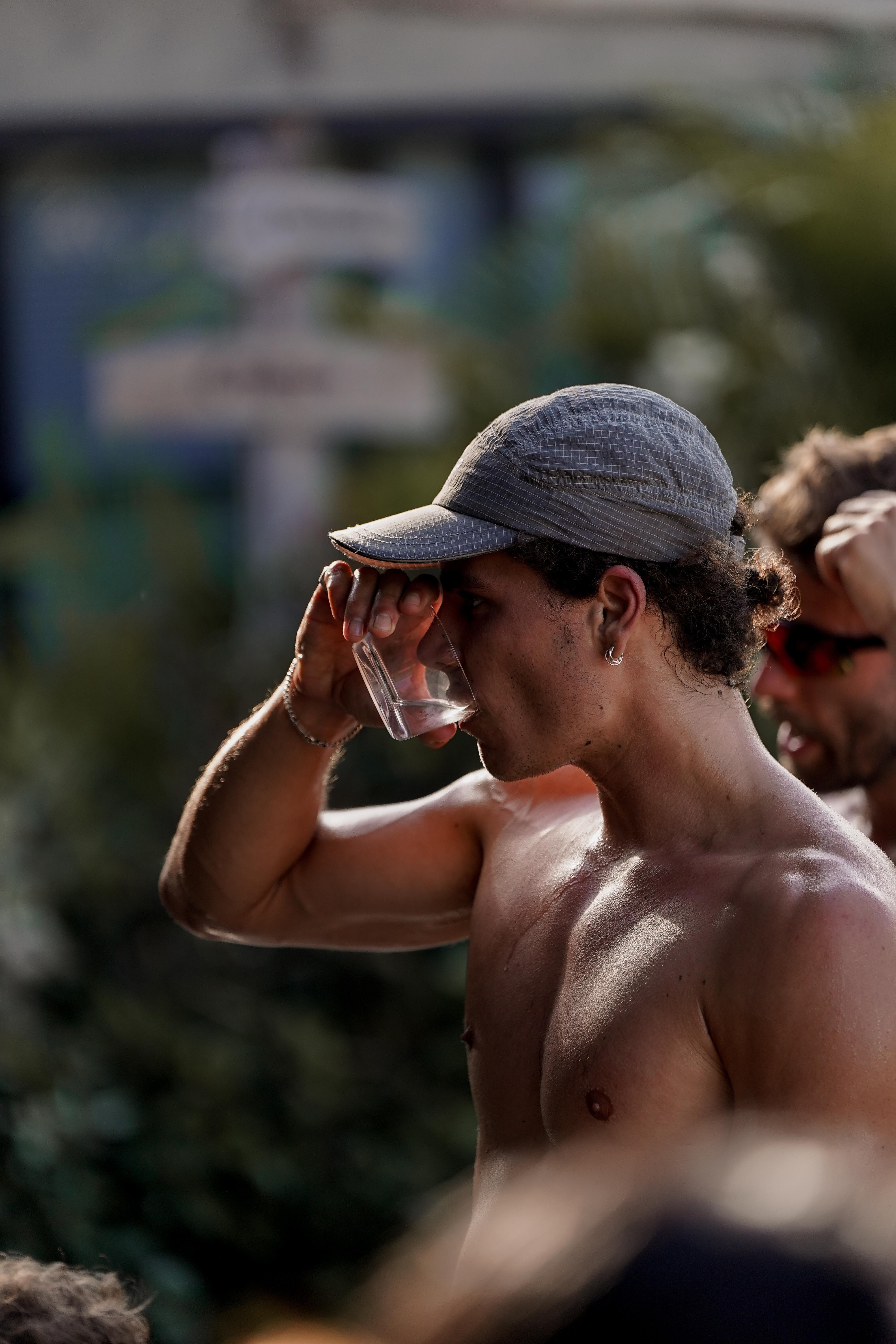 Young Athletic Man Hydrating Outdoors · Free Stock Photo
