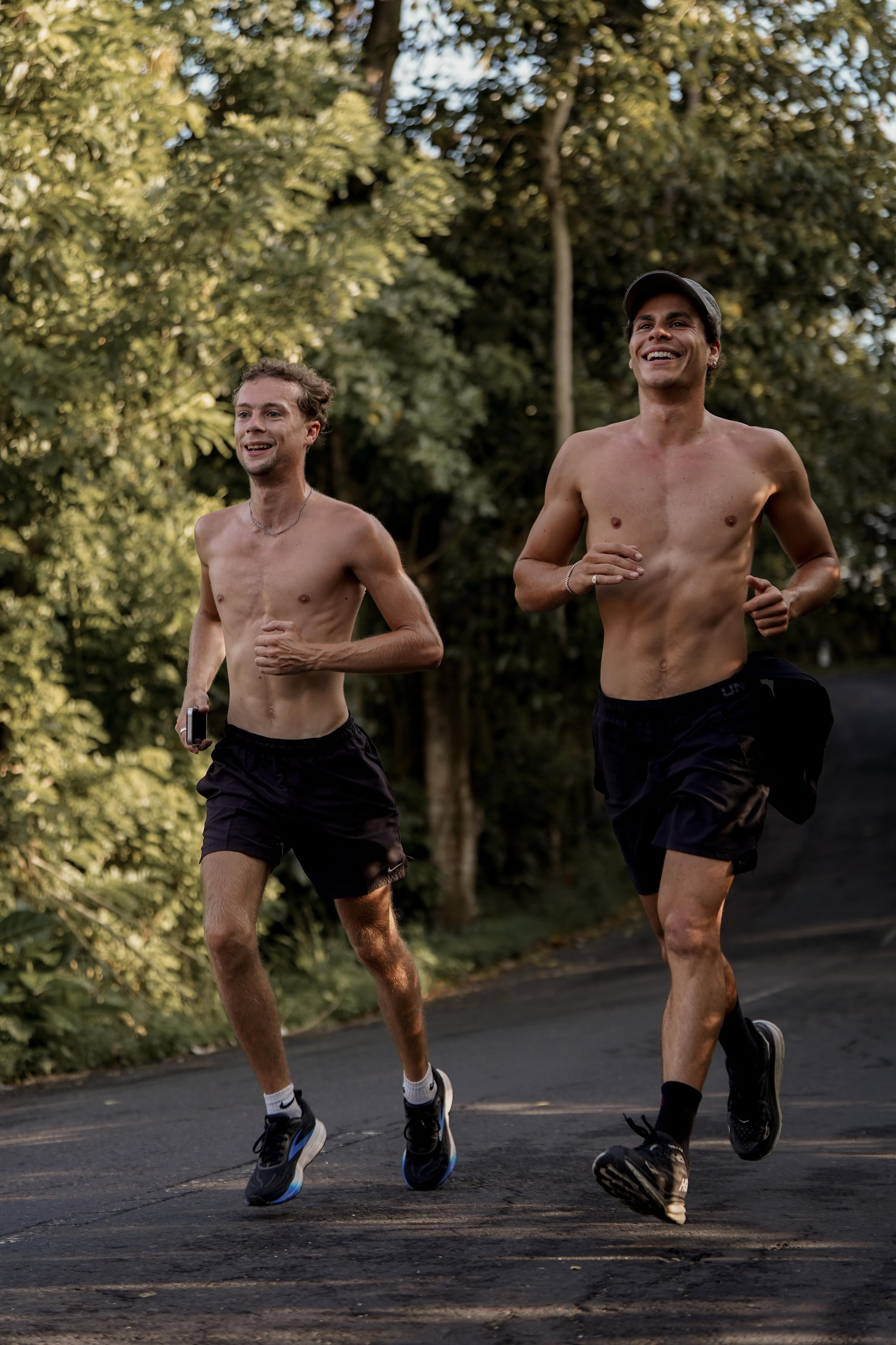 Two Men Enjoy a Morning Run in Nature · Free Stock Photo