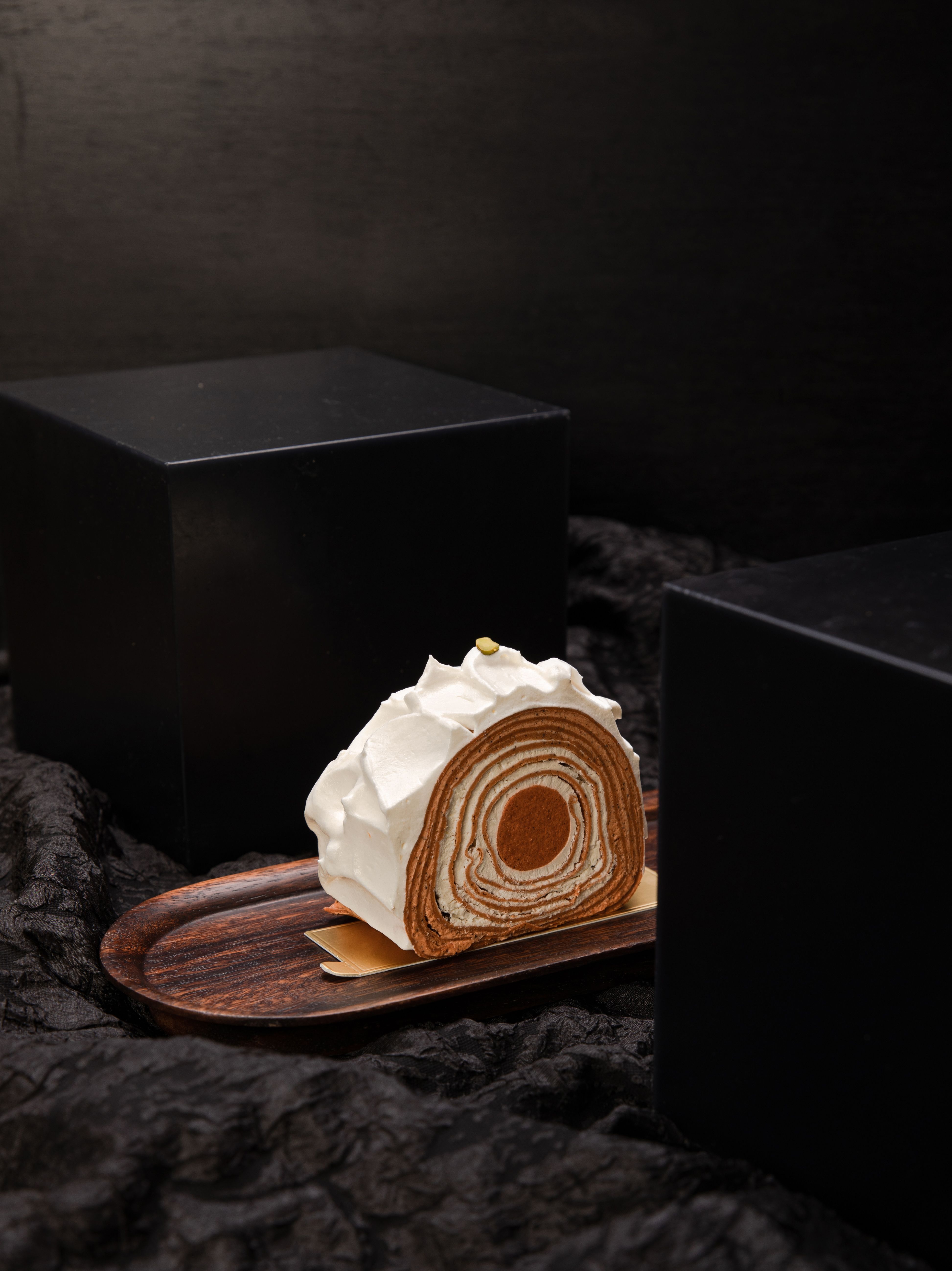 Elegant Dessert Roll with Whipped Cream Topping · Free Stock Photo