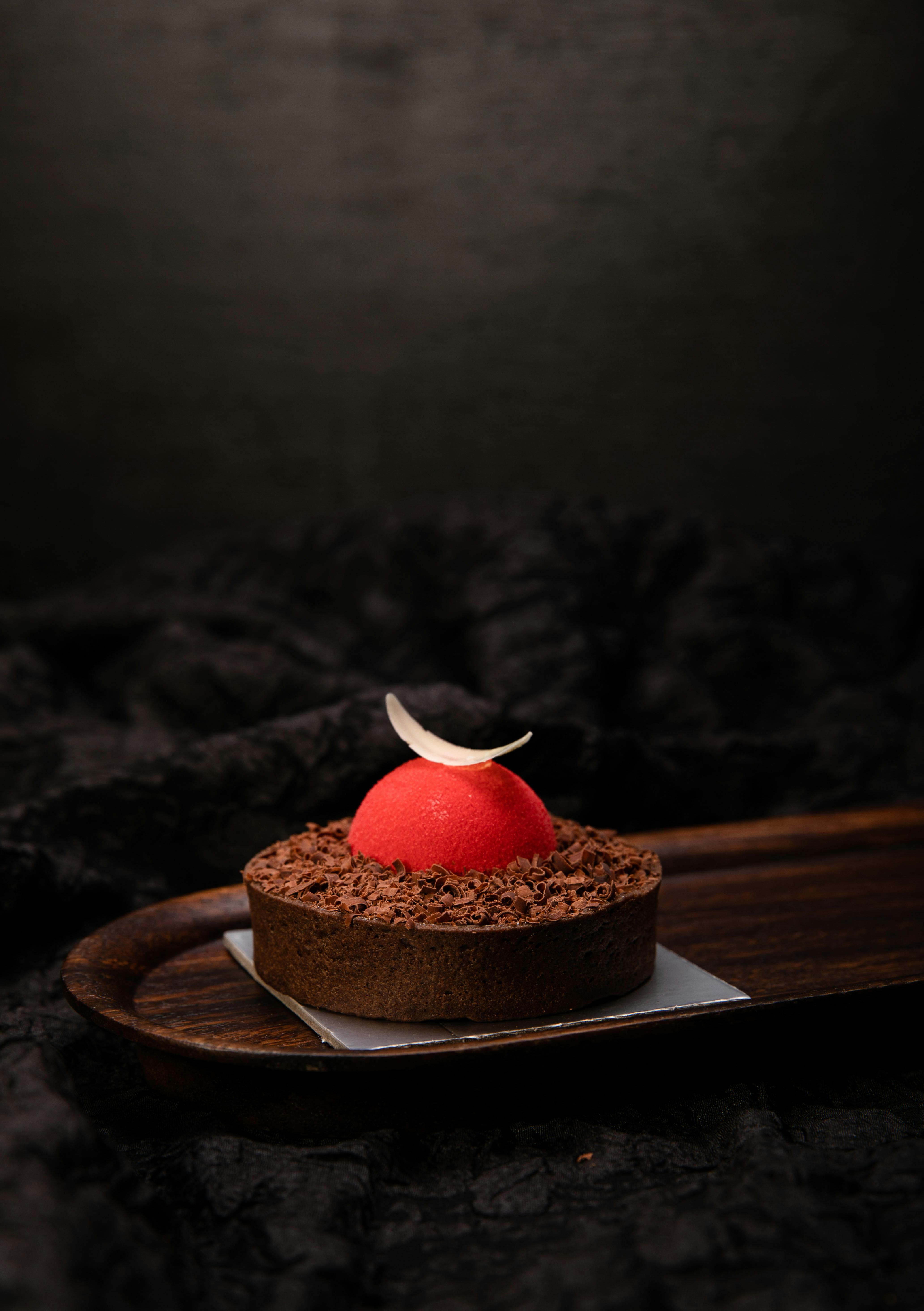 Elegant Chocolate Dessert with Red Glaze on Dark Background · Free ...