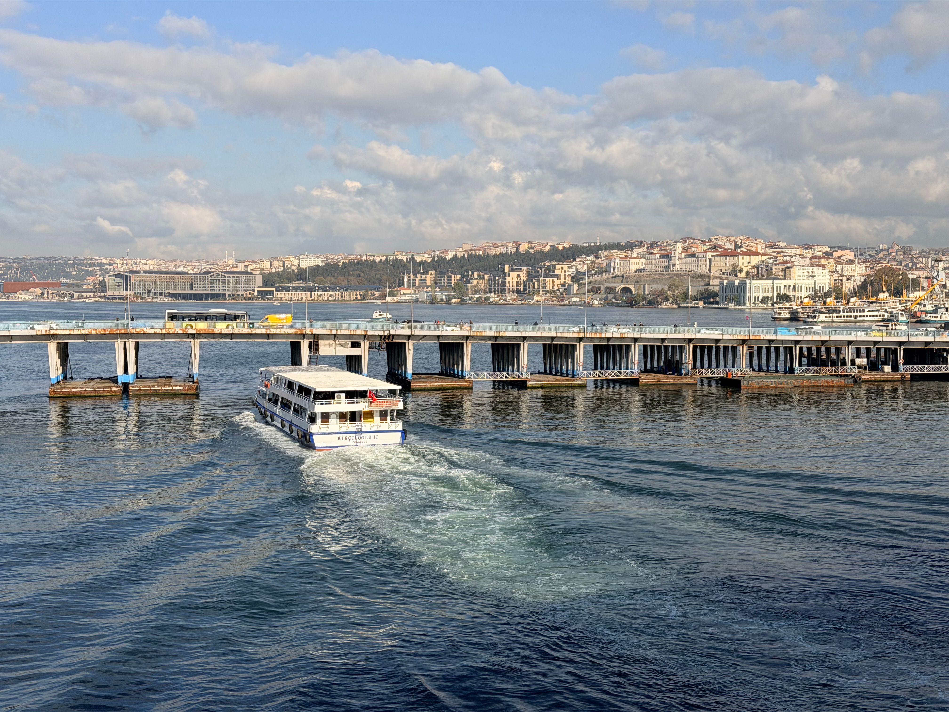Ferry Crossing Under Galata Bridge in Istanbul · Free Stock Photo
