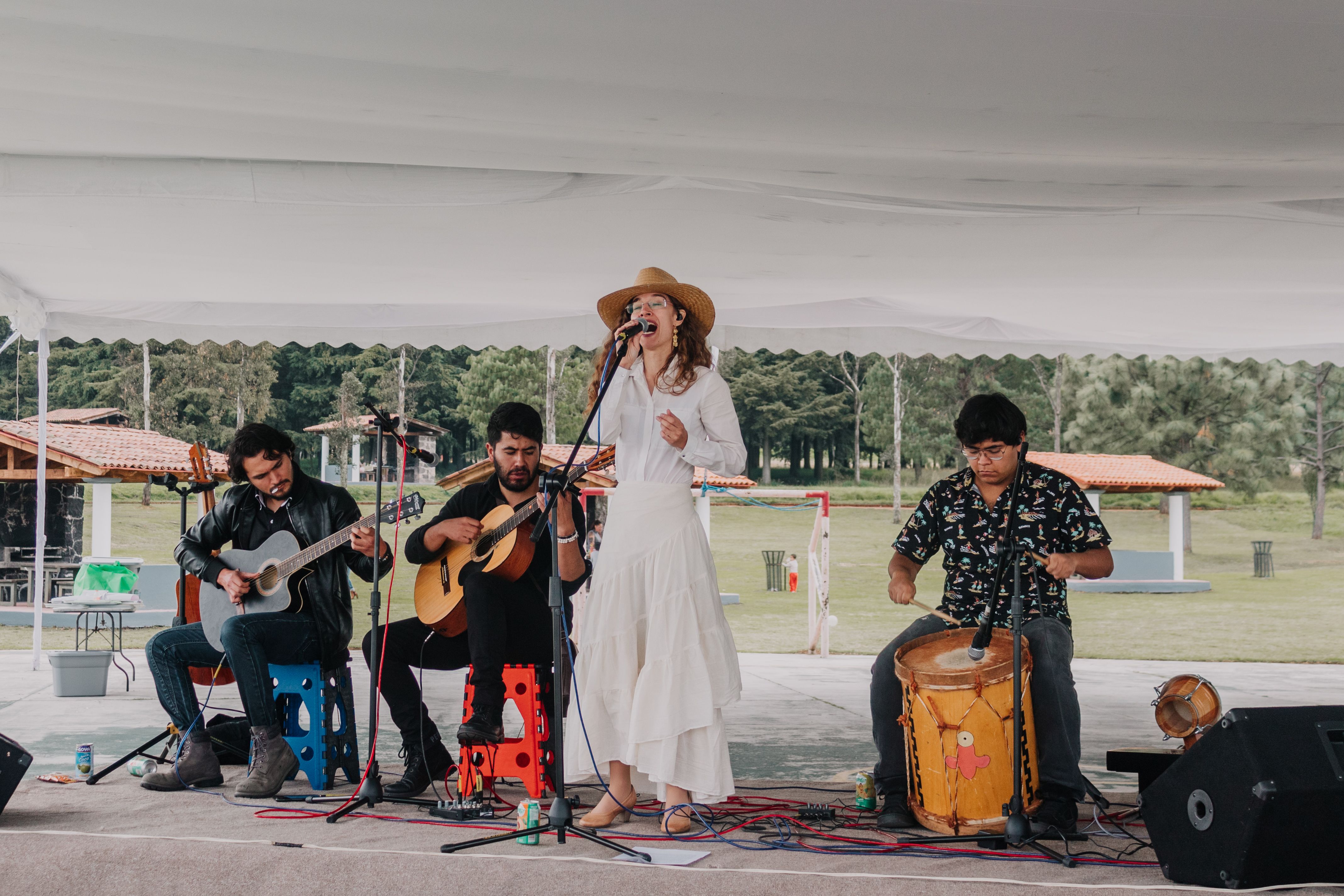 Outdoor band performing under tent at daytime · Free Stock Photo