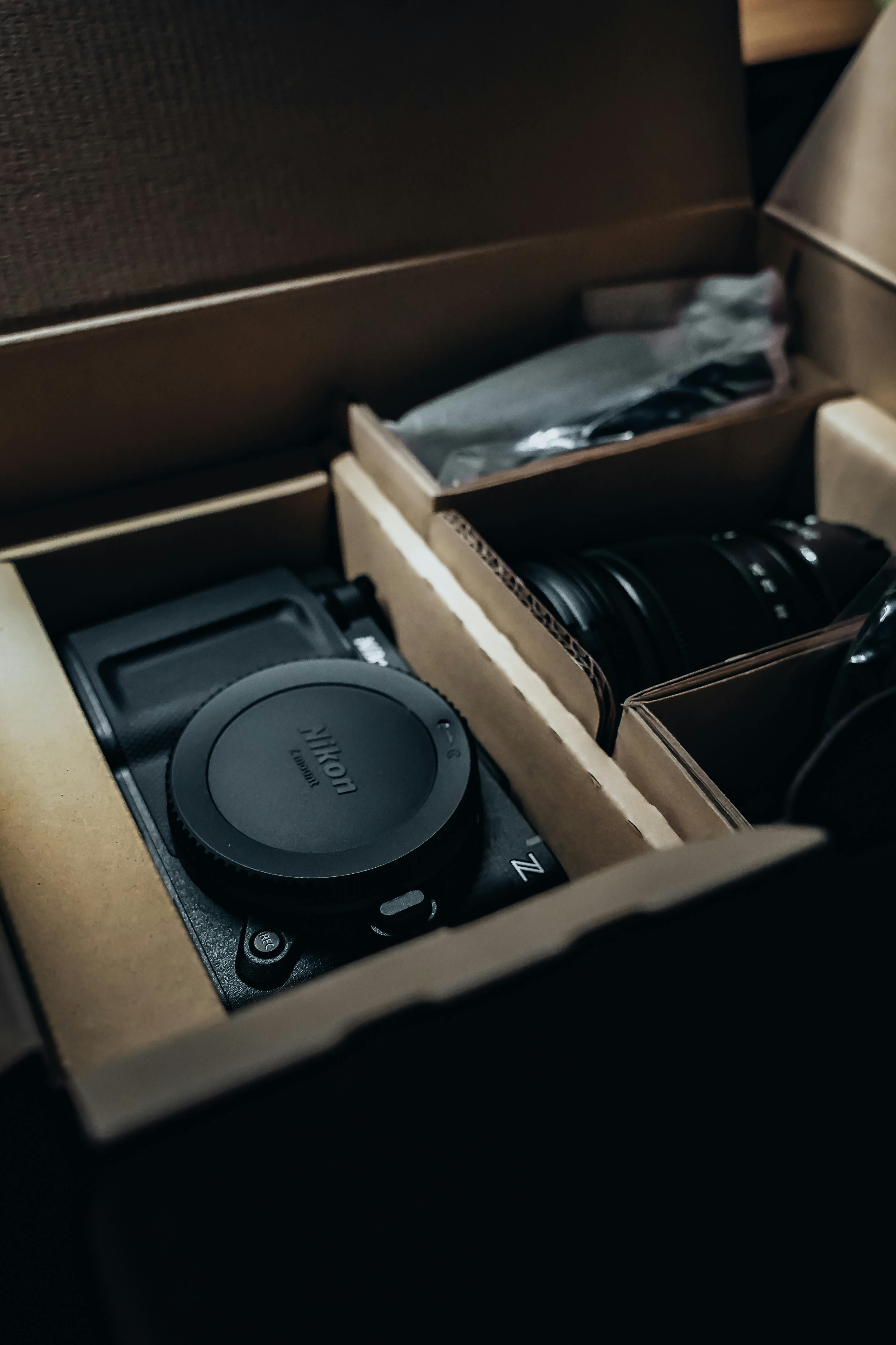 Unboxing a New Camera: Nikon Mirrorless Setup · Free Stock Photo