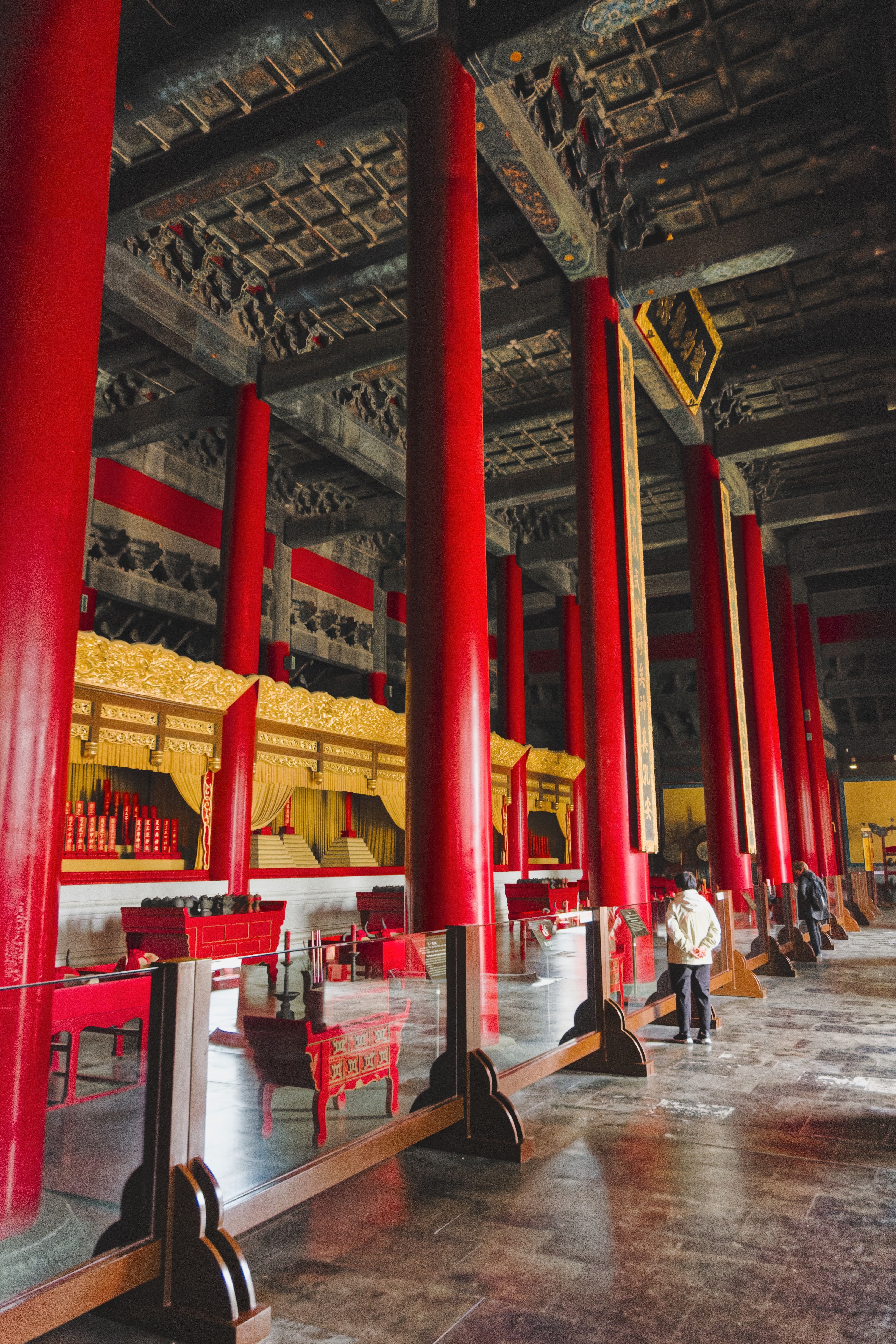 Exploring the Majestic Hall with Red Pillars · Free Stock Photo
