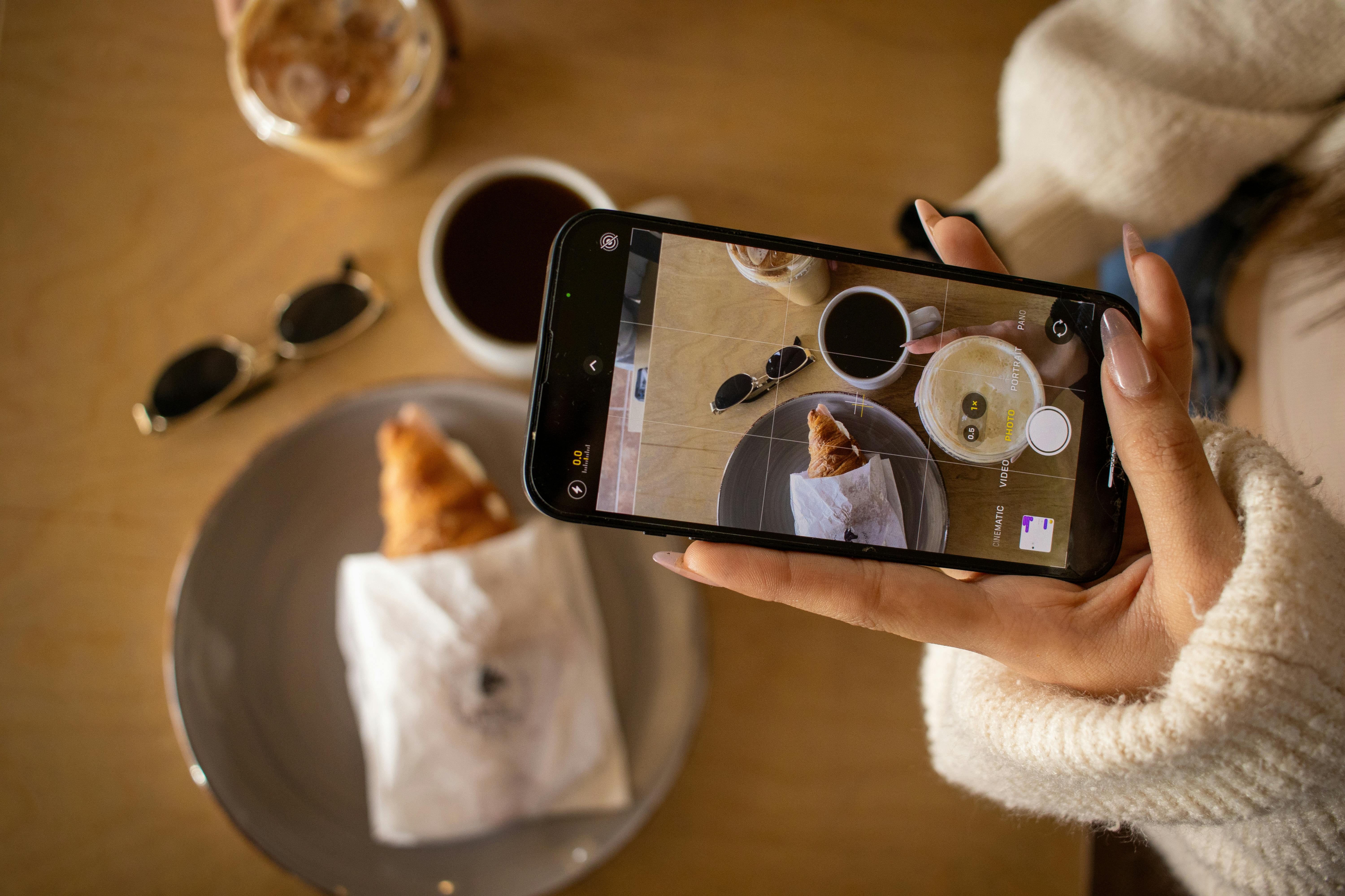 Capturing a Coffee Moment at a Cozy Cafe · Free Stock Photo