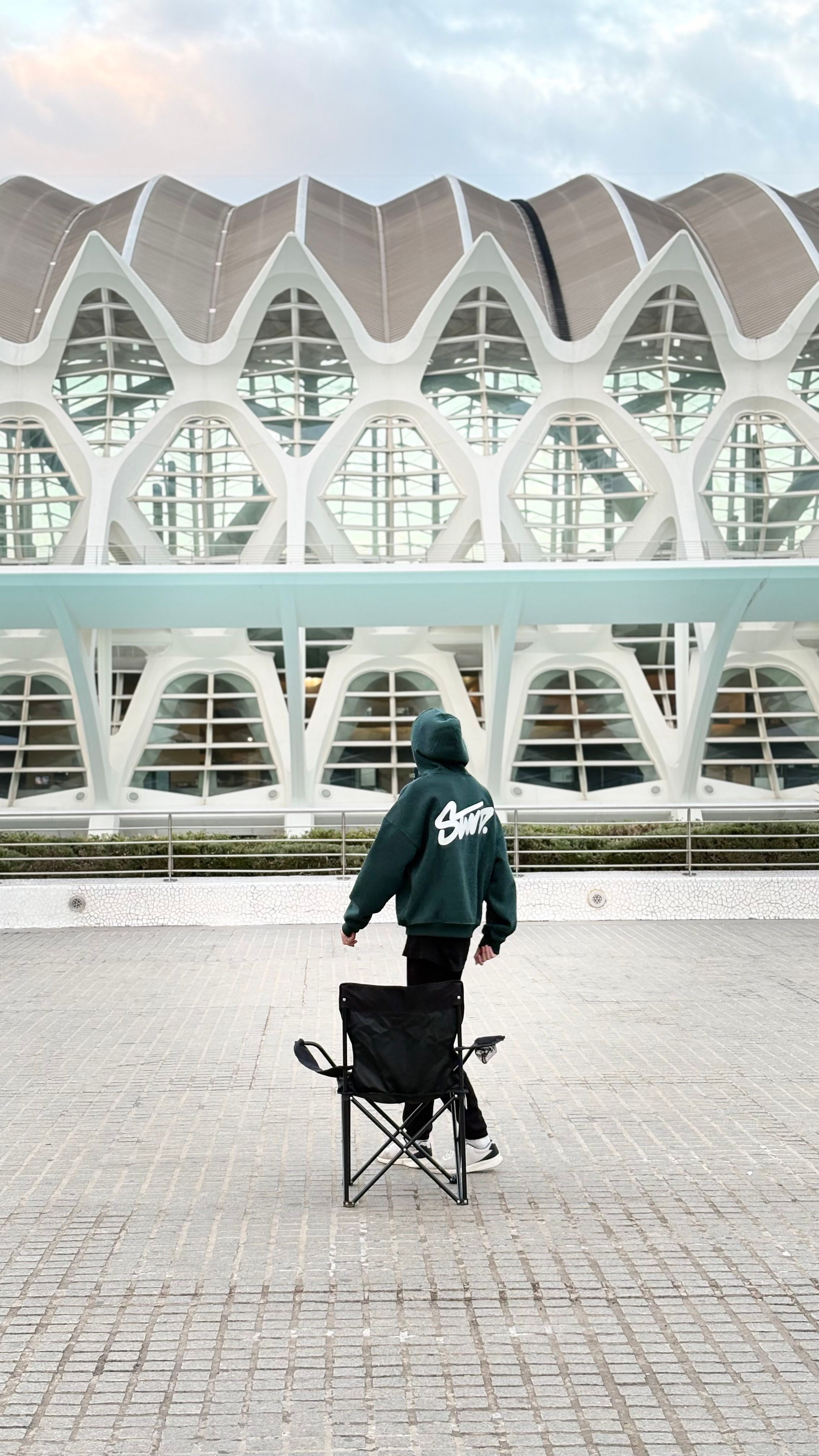 Person at Iconic Modern Architecture Facade · Free Stock Photo