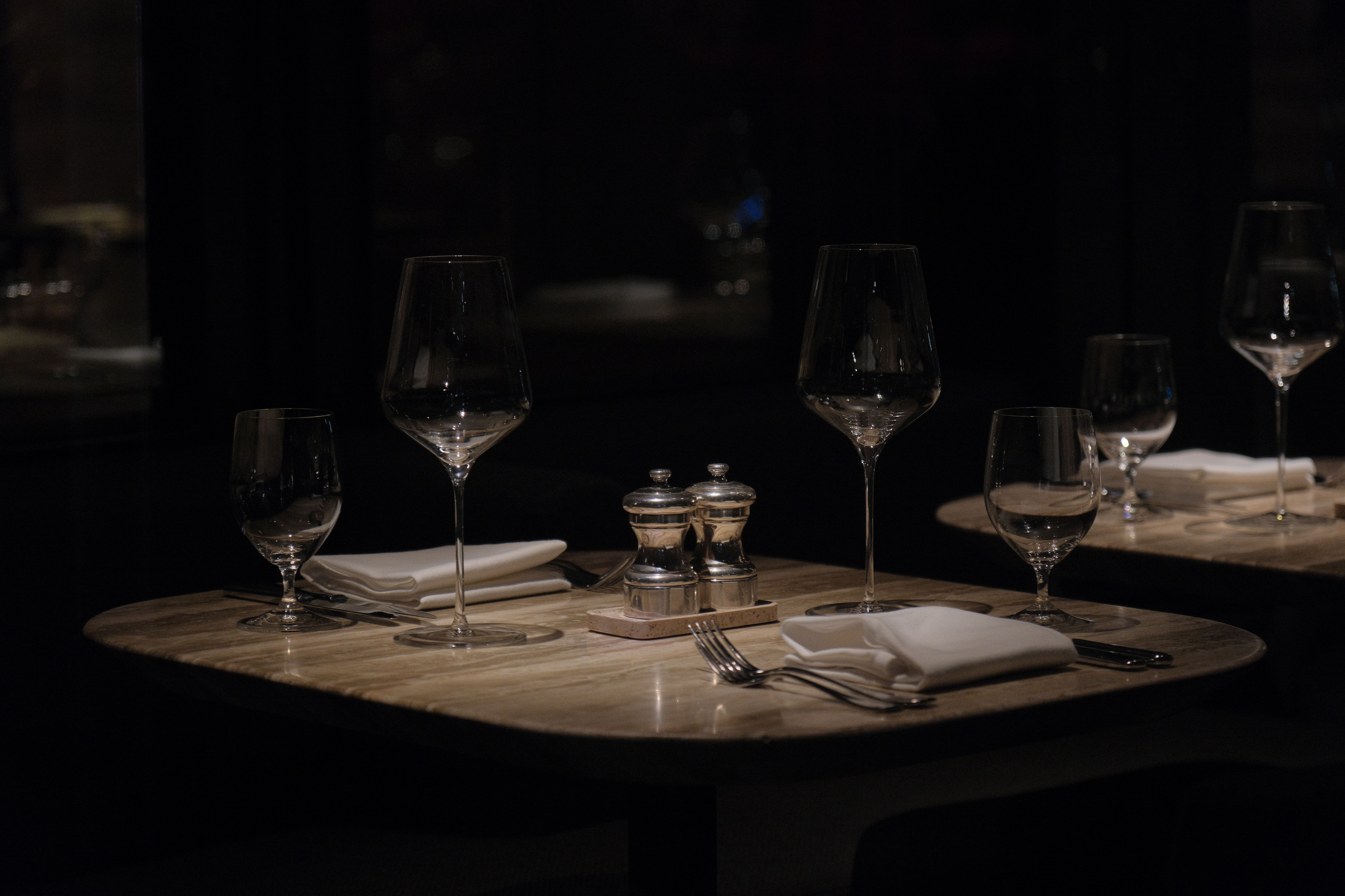 Elegant Dining Setting in Dimly Lit Restaurant · Free Stock Photo
